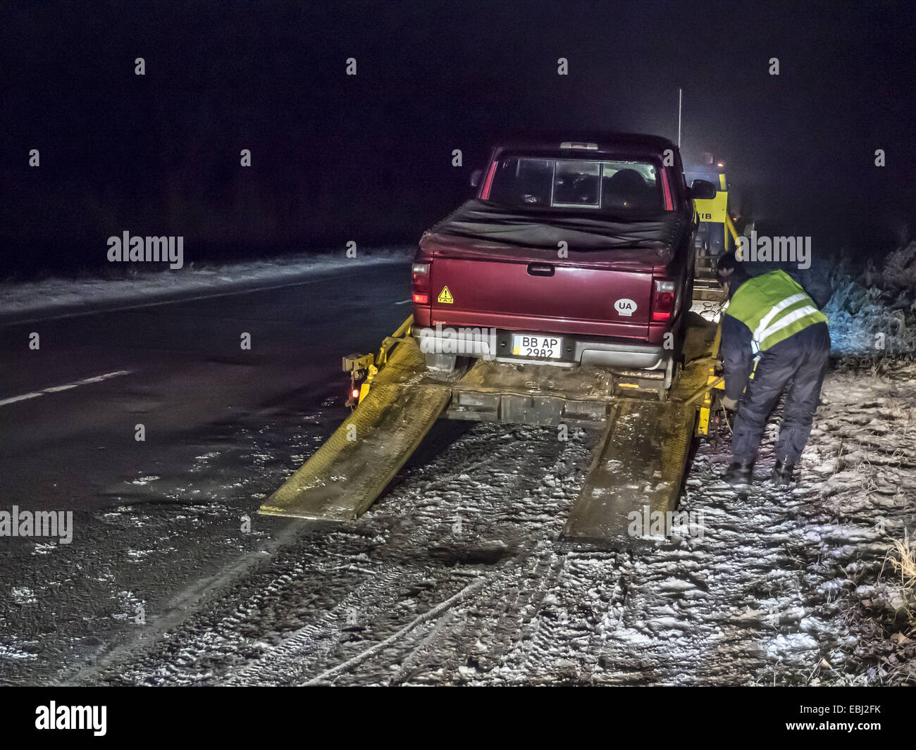 Truck Ford Ranger was evacuated after the breakdown on the winter road ...