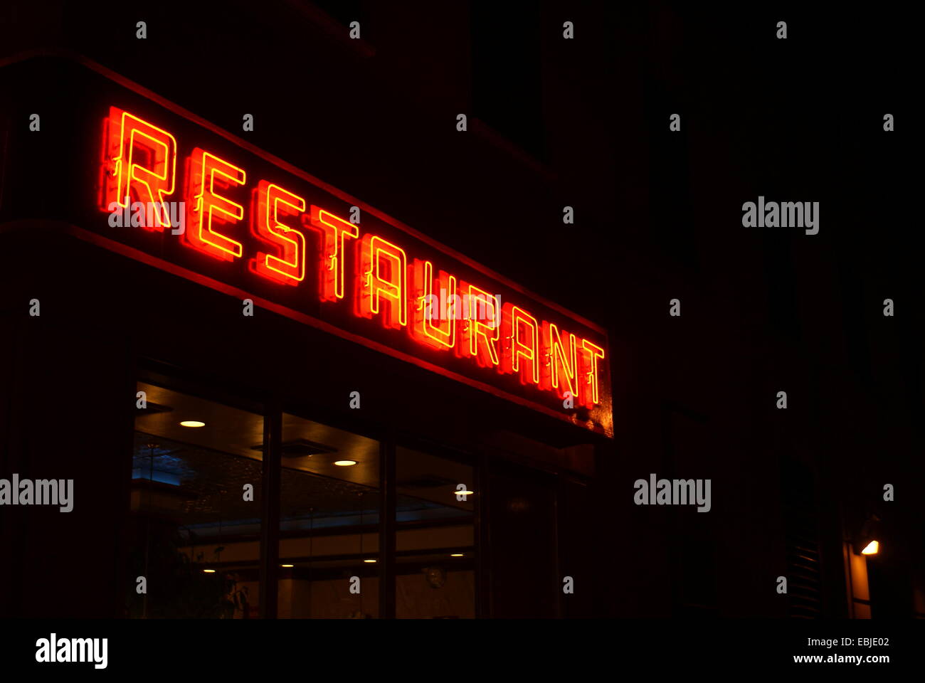 A neon restaurant sign by night in New York City Stock Photo - Alamy