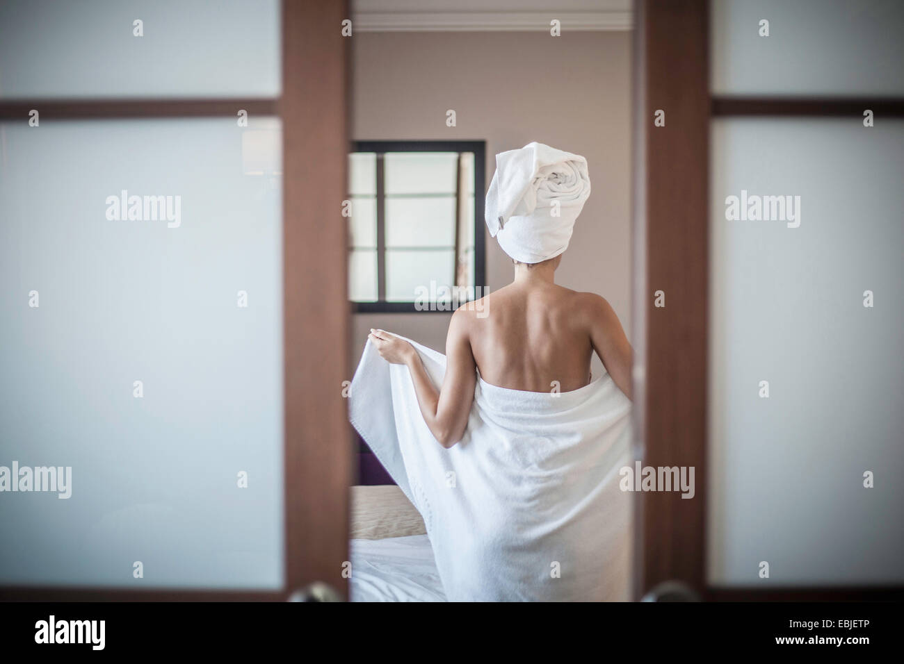 Young woman wearing towel Stock Photo - Alamy