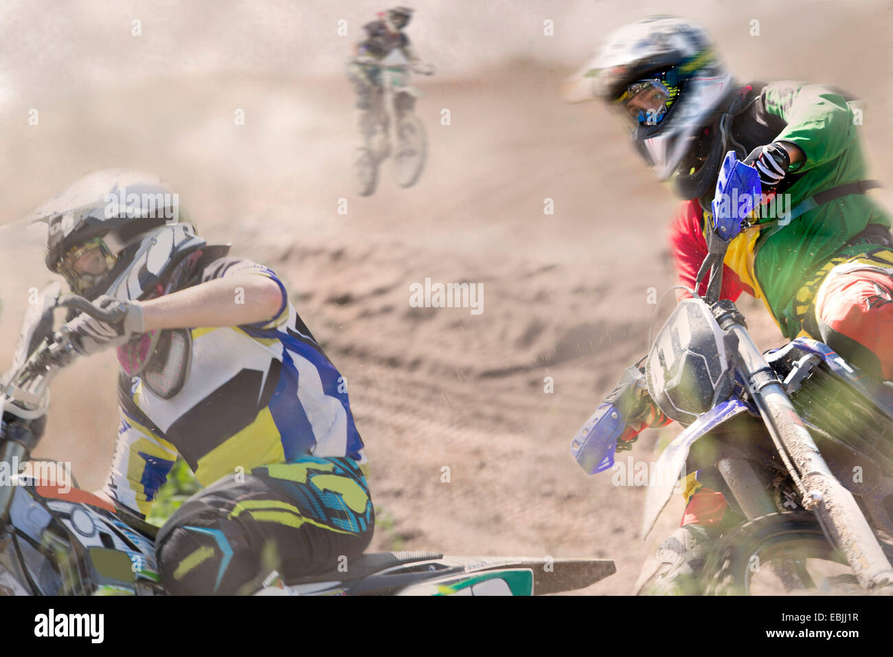 Three young male motocross riders racing on dusty track Stock Photo - Alamy