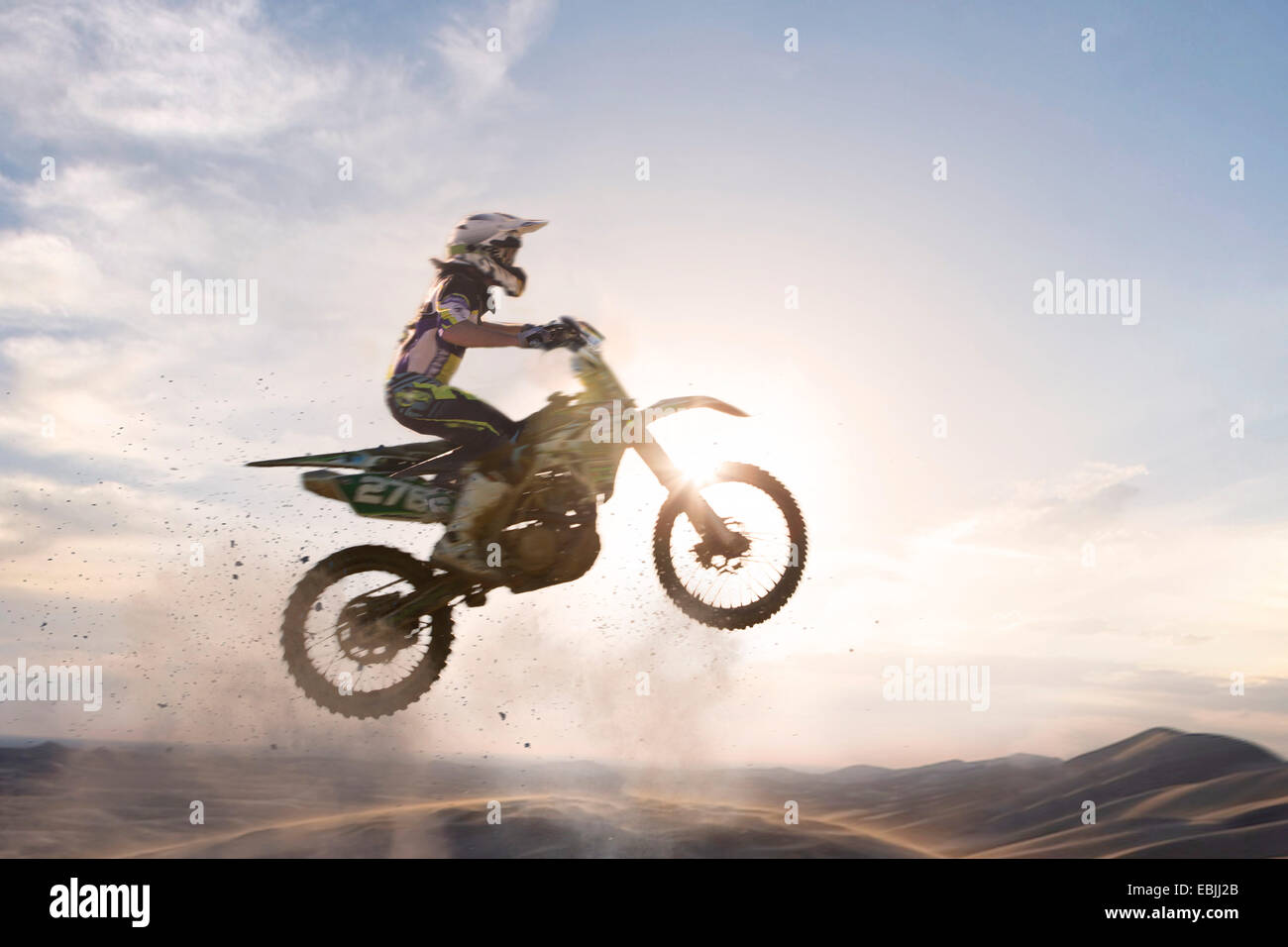 Silhouette motocross racer jumping on hi-res stock photography and ...
