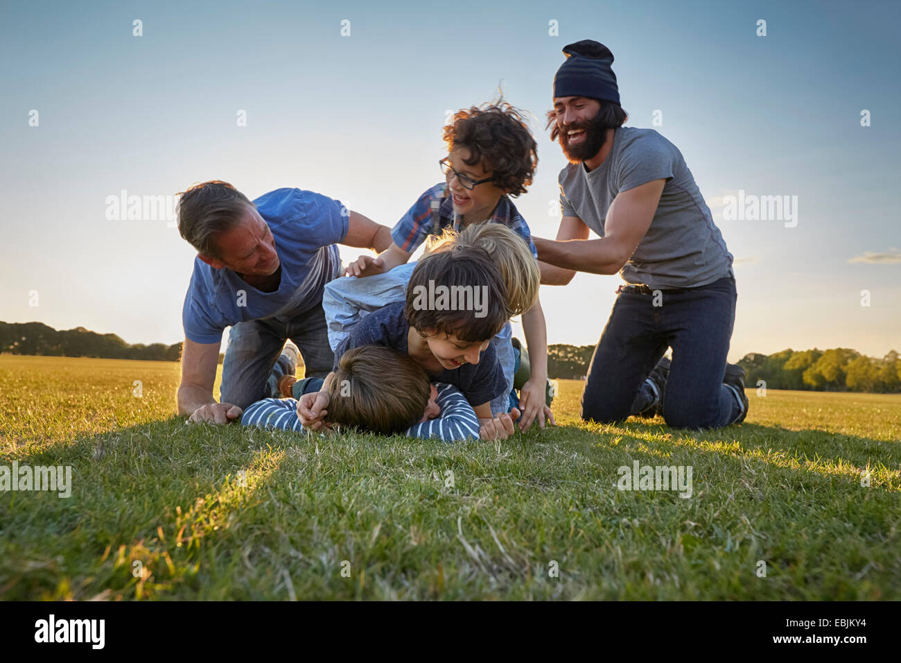 Family enjoying outdoor activities in the park Stock Photo - Alamy