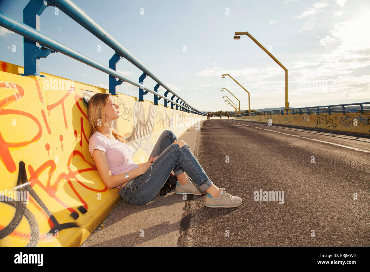 Women leaning against wall on hi-res stock photography and images - Alamy