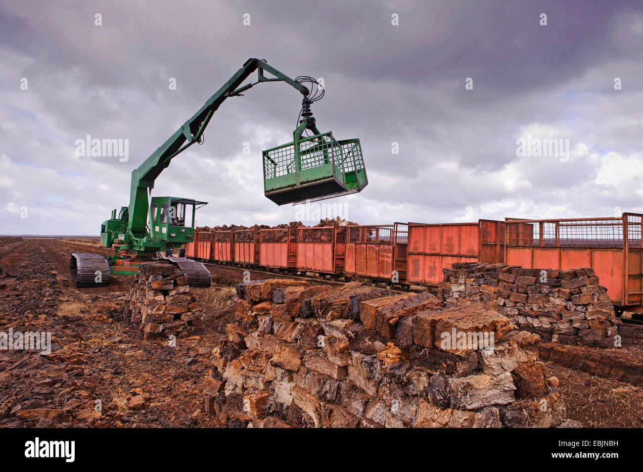 moor railway being loaded with bales of peat with the help of an ...