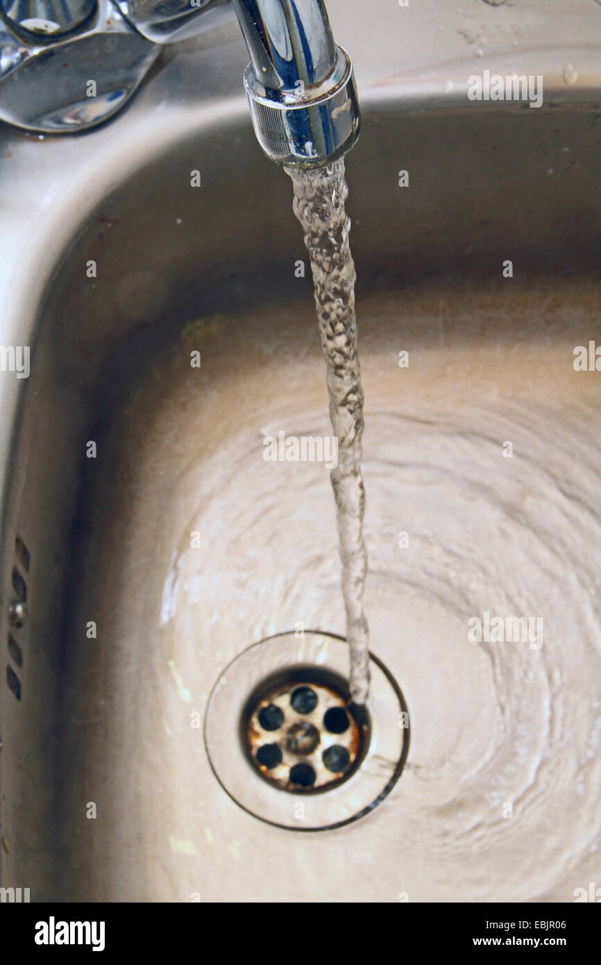 water running into the sink in the kitchen, Germany Stock Photo - Alamy