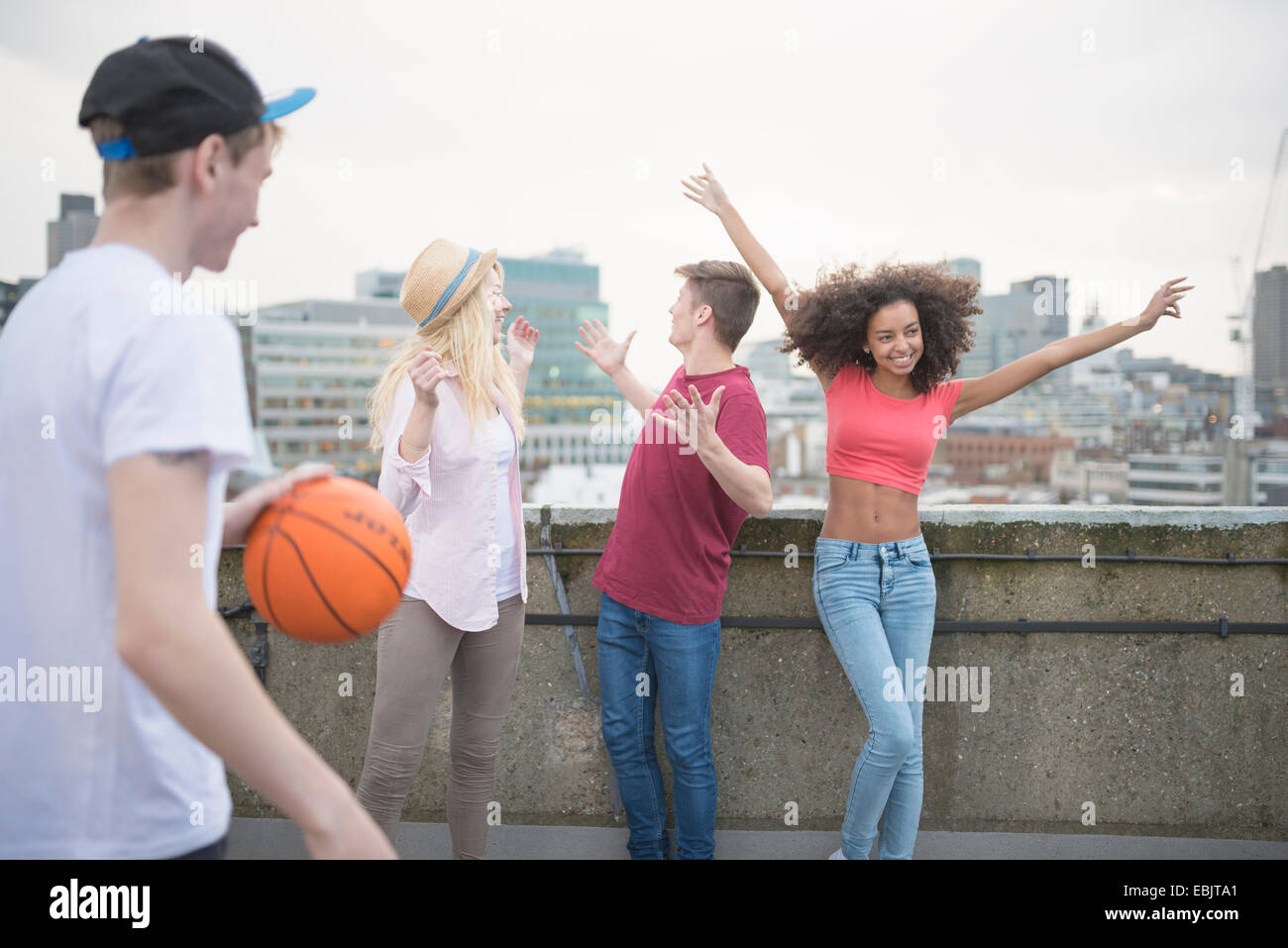 Group of friends dancing, boy with basketball Stock Photo - Alamy