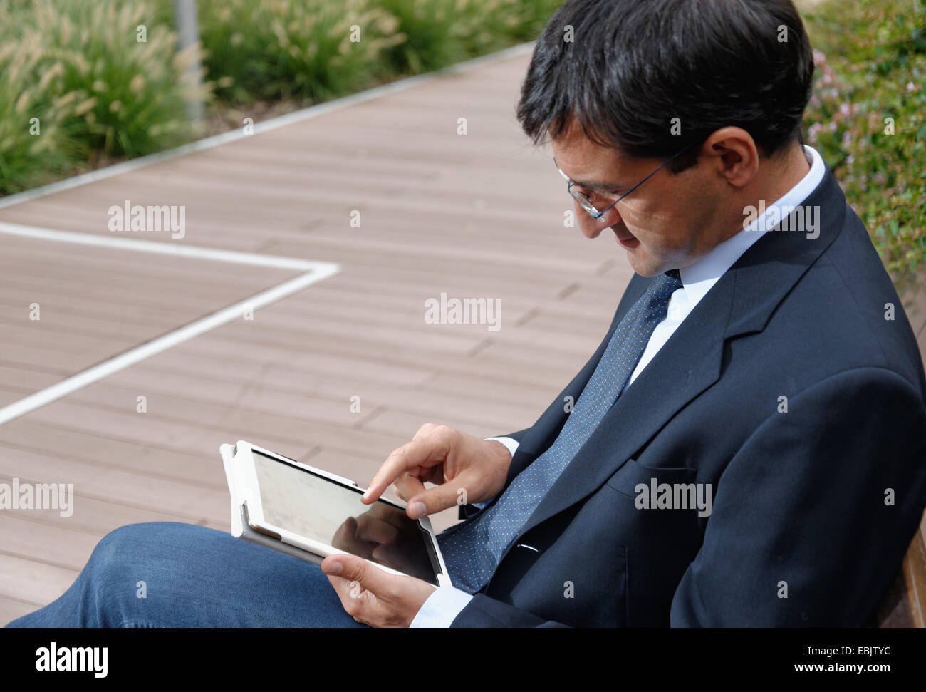 Man using digital tablet Stock Photo - Alamy Man using digital tablet Stock Photo - Alamy