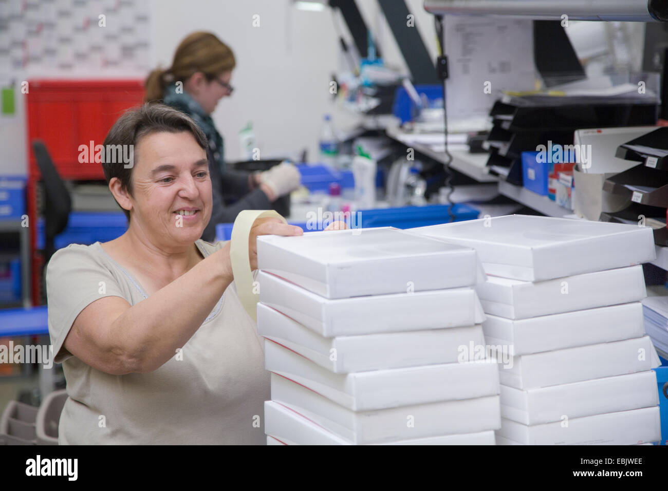 Workers packing at healthcare warehouse Stock Photo - Alamy