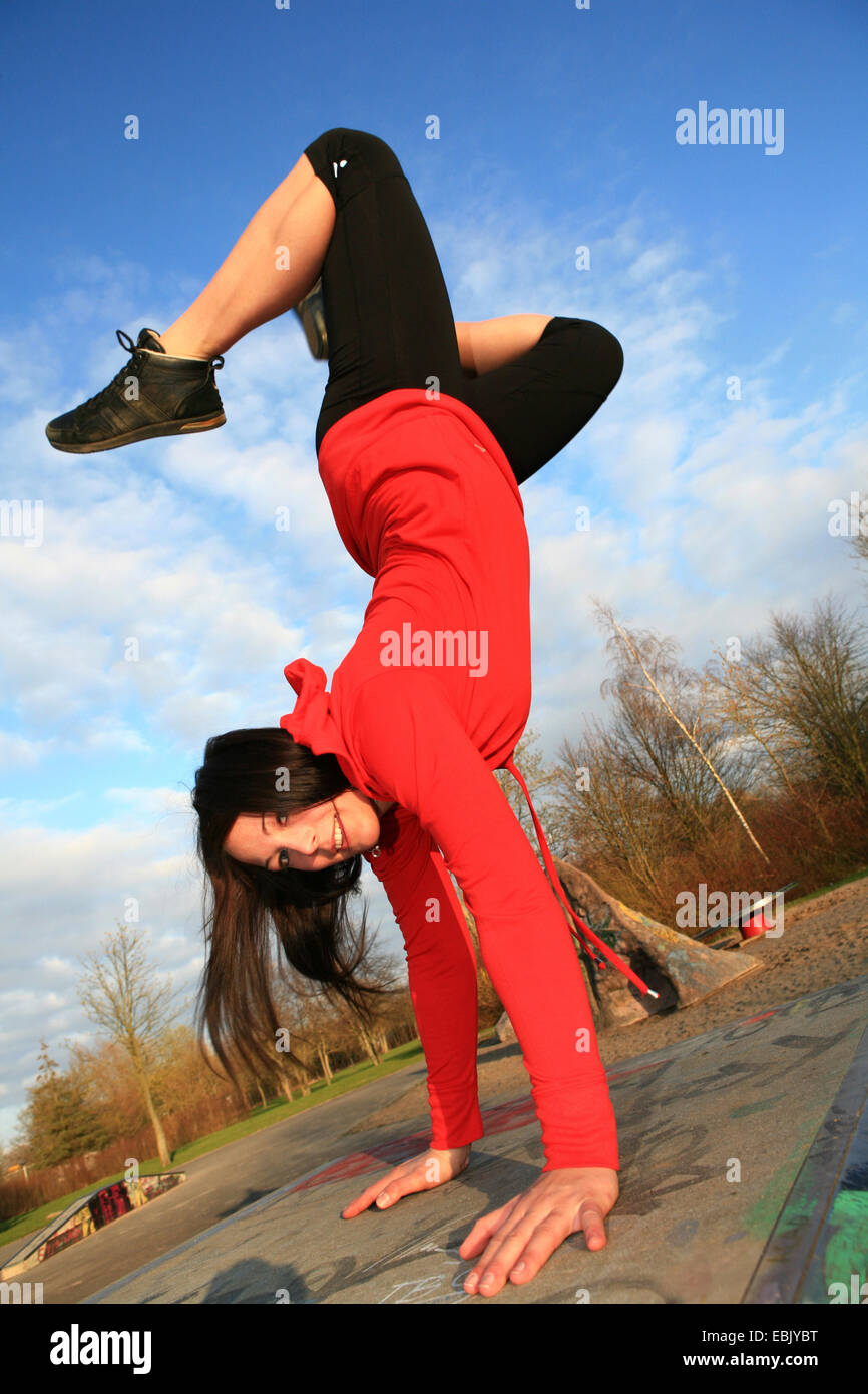 Teen girl doing handstand hi-res stock photography and images - Alamy
