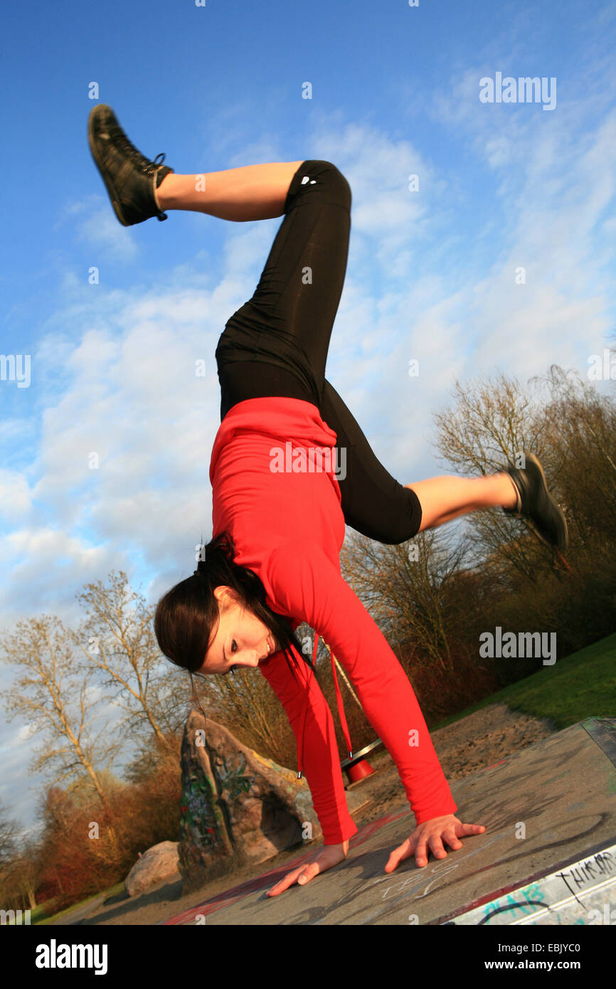 Young woman doing a handstand hi-res stock photography and images - Alamy