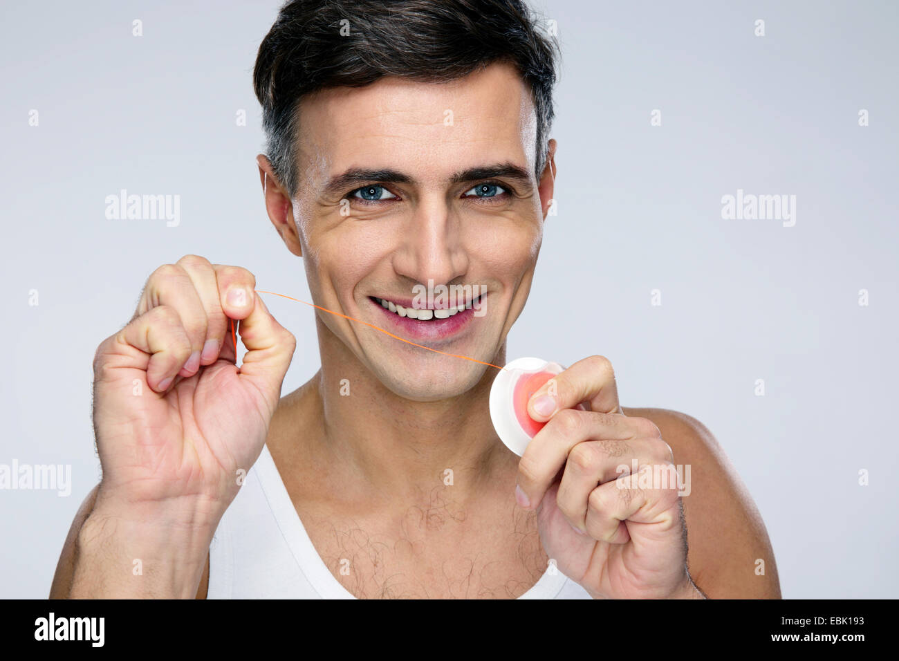 Man flossing teeth hi-res stock photography and images - Alamy