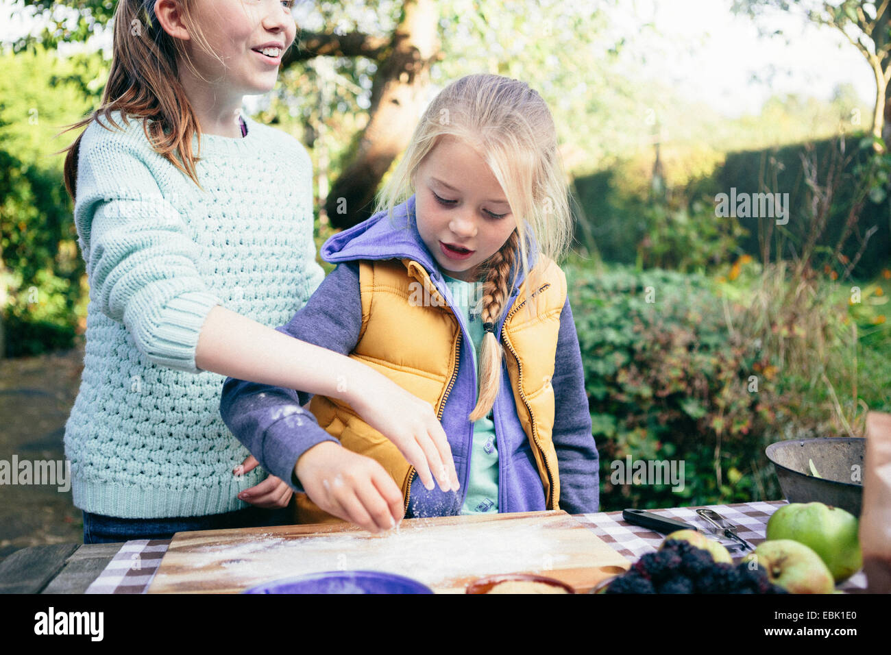 Two girls making food Stock Photo - Alamy