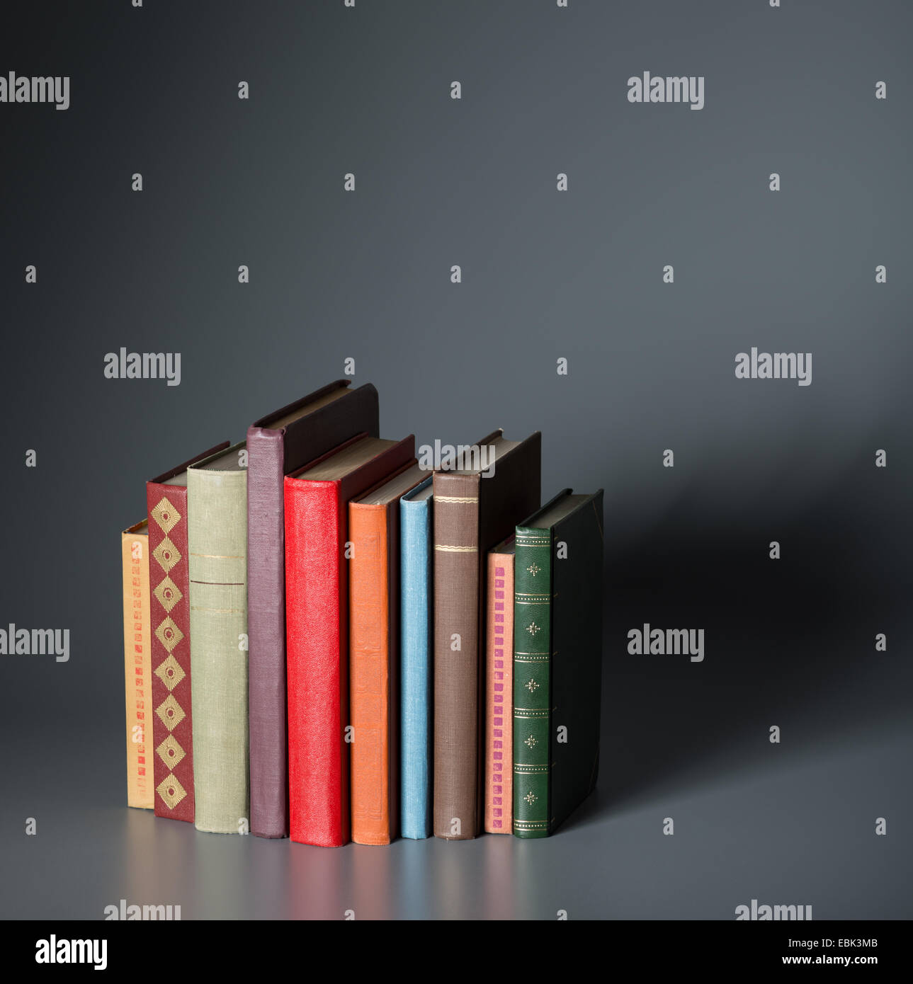 Books on a dark background Stock Photo - Alamy