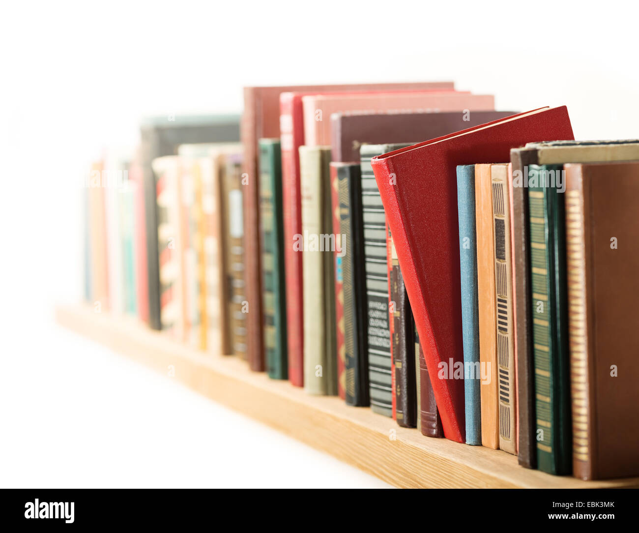 Books in a row. Shallow depth of field Stock Photo - Alamy