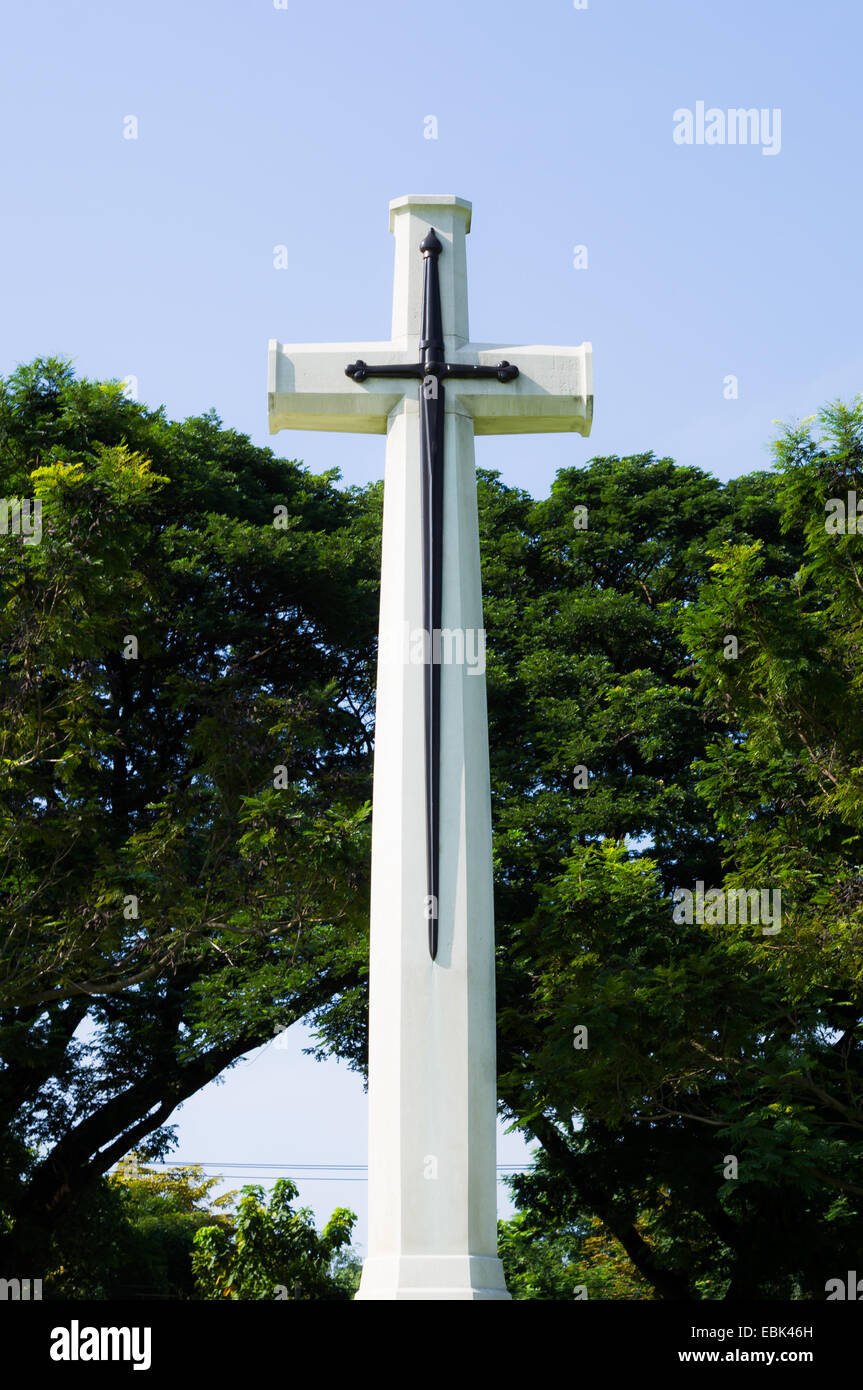 Cross with green trees in background Stock Photo - Alamy