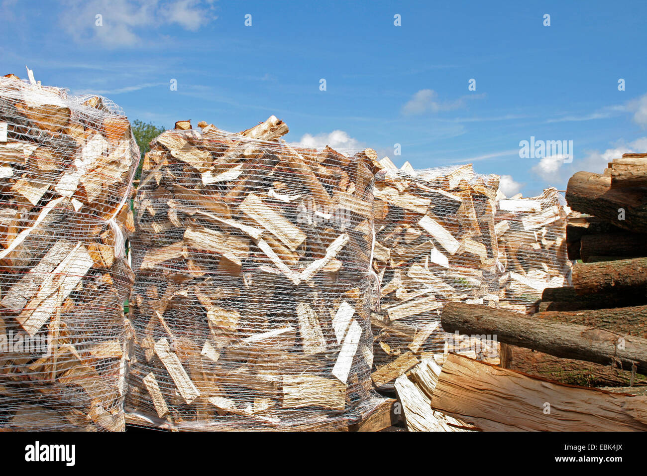 firewood working, storage area with sacks of firewood, Germany Stock ...