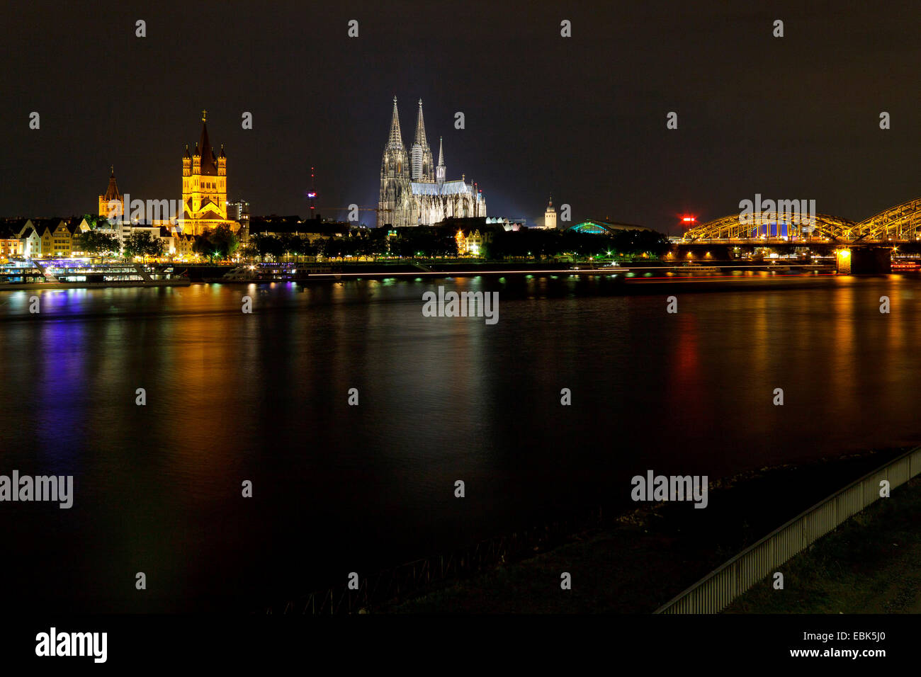Rhine riverside in Cologne at night, with old city, chuirch Gross St ...