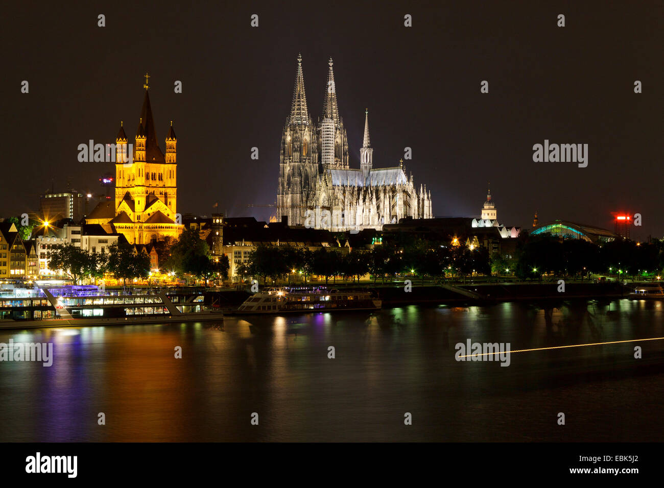 Rhine riverside in Cologne at night, with old city, chuirch Gross St ...