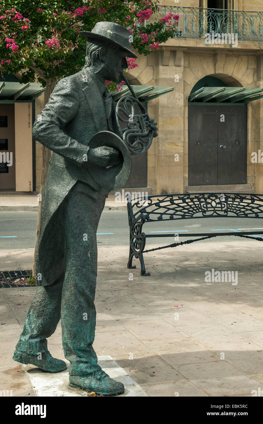 Statue of a musician playing the horn in the street of the town of Haro ...