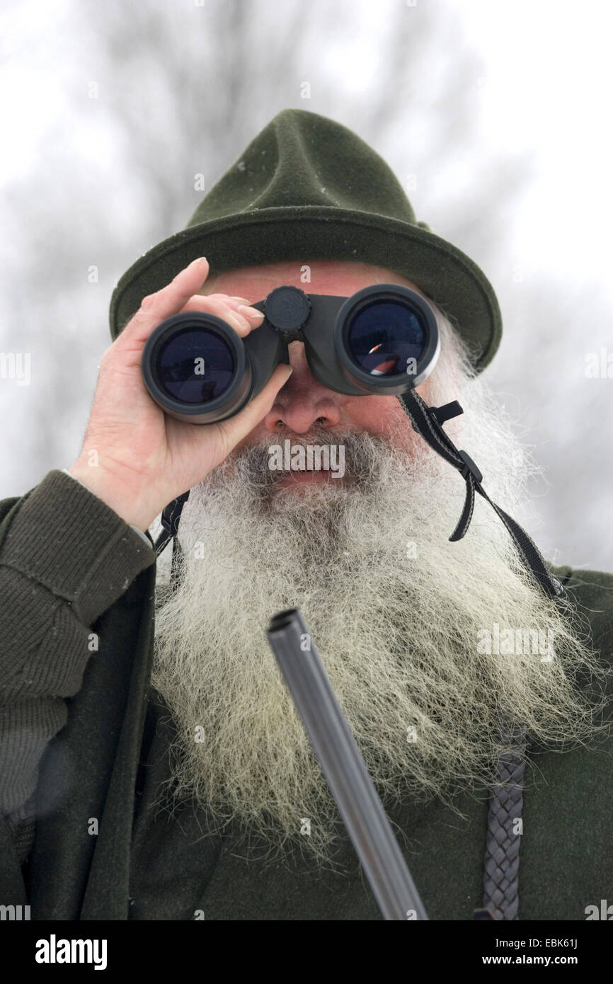 white bearded hunter looking through a spyglass, Germany Stock Photo ...