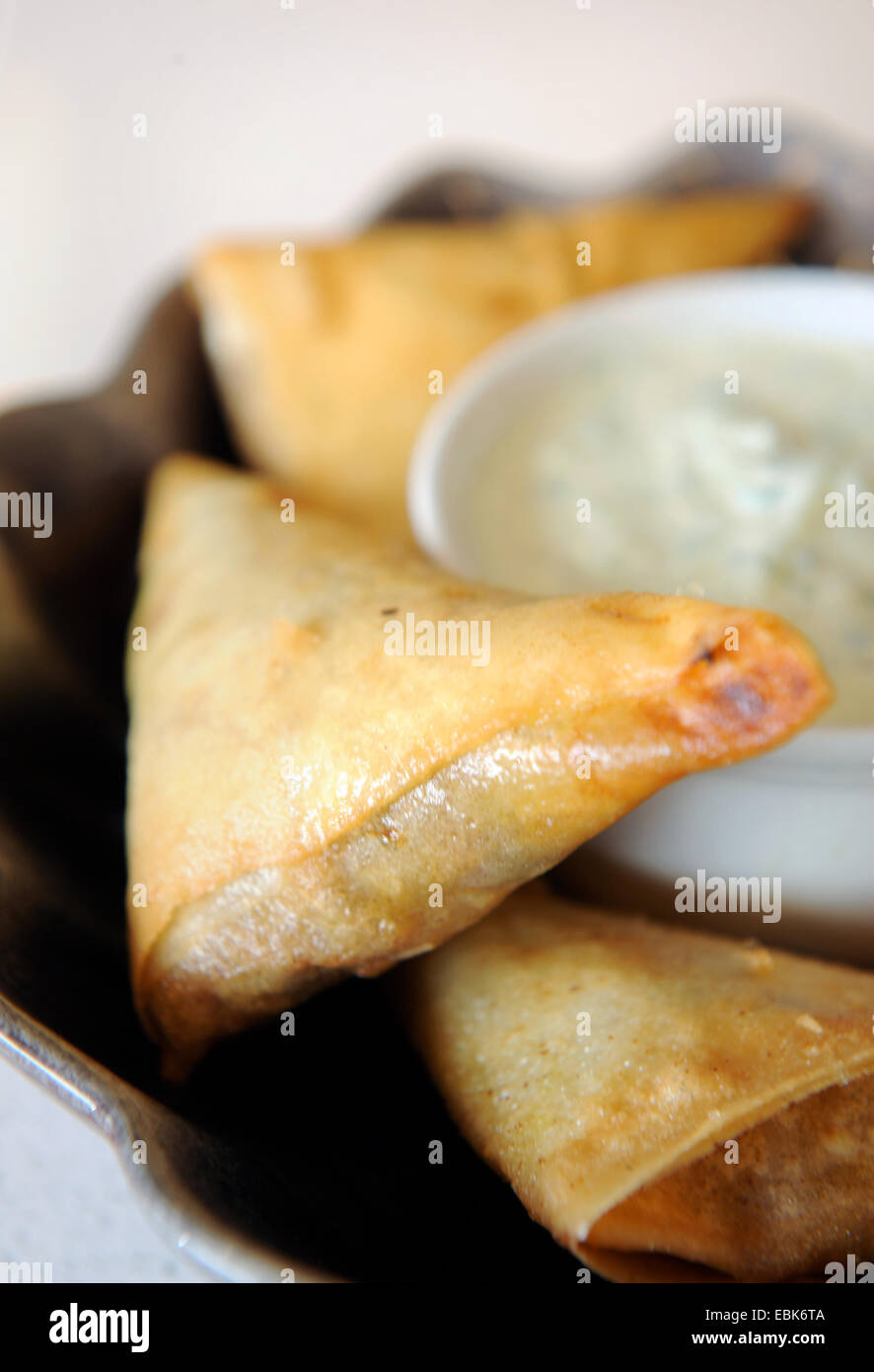 Chicken Samosa with garlic dip Stock Photo - Alamy