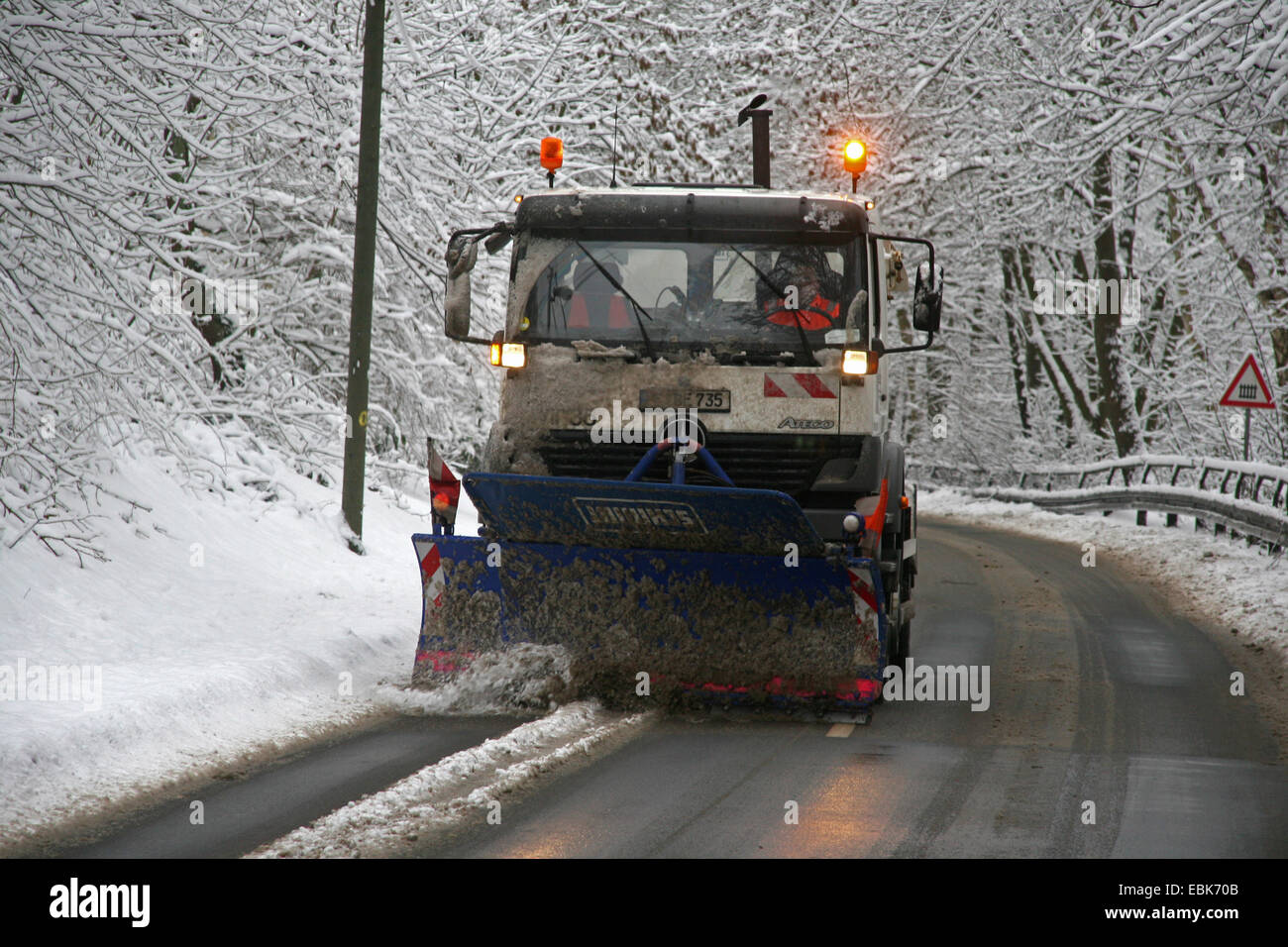Snow plough ploughing the street High Resolution Stock Photography and ...
