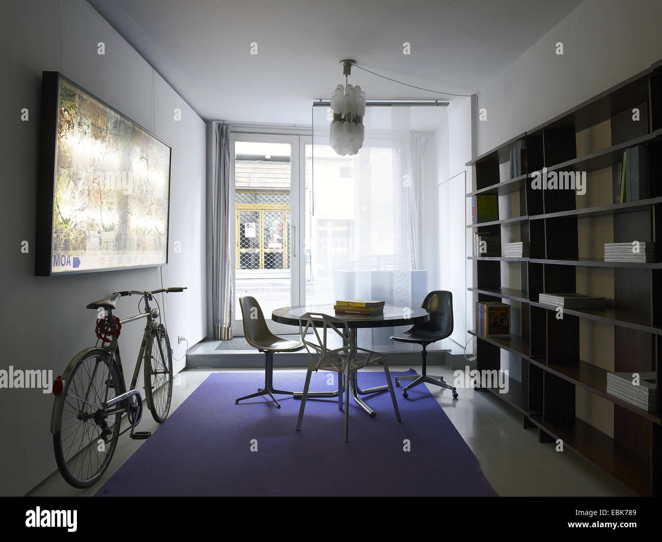Entrance of an office studio with a bicycle parked inside Stock Photo ...