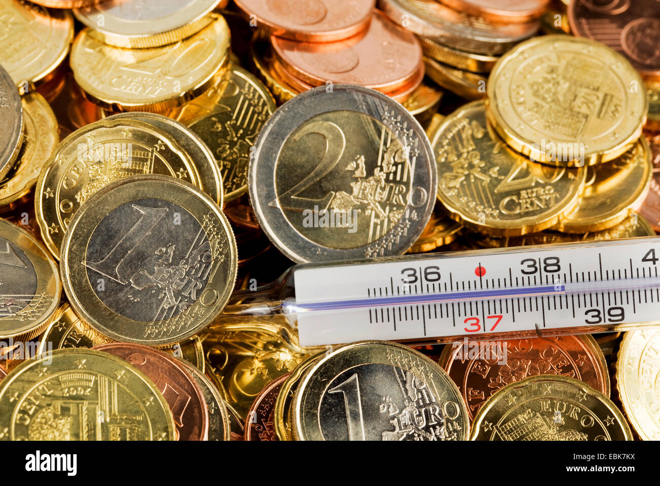 Euro coins and thermometer Stock Photo - Alamy