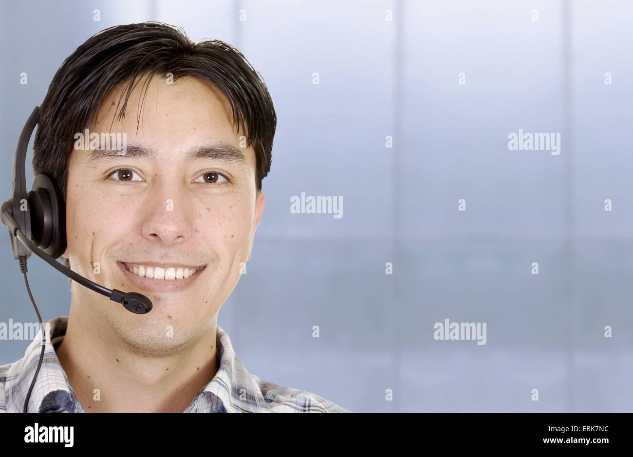 friendly customer service man smiling Stock Photo - Alamy