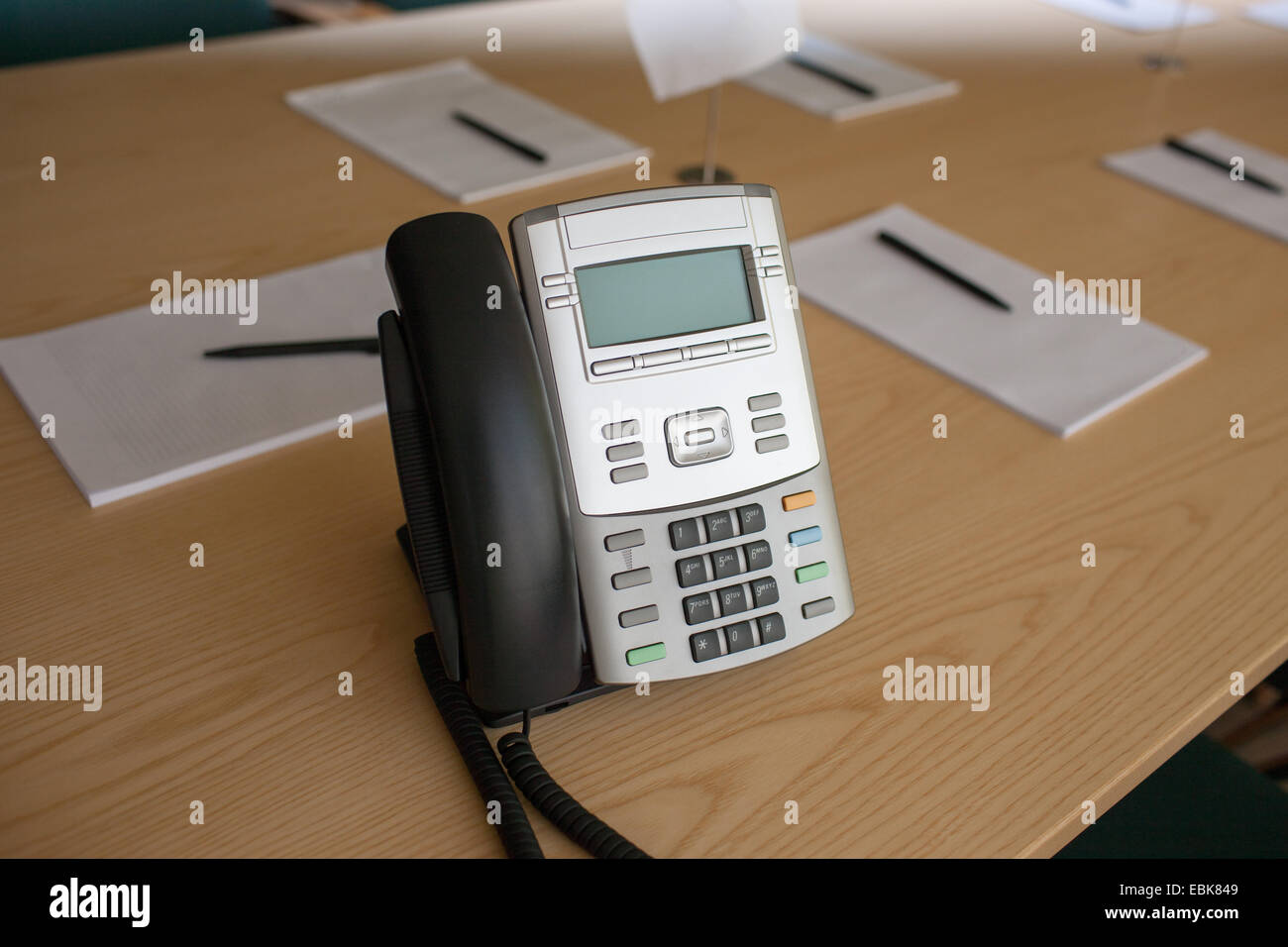 Phone on table in meeting room Stock Photo - Alamy