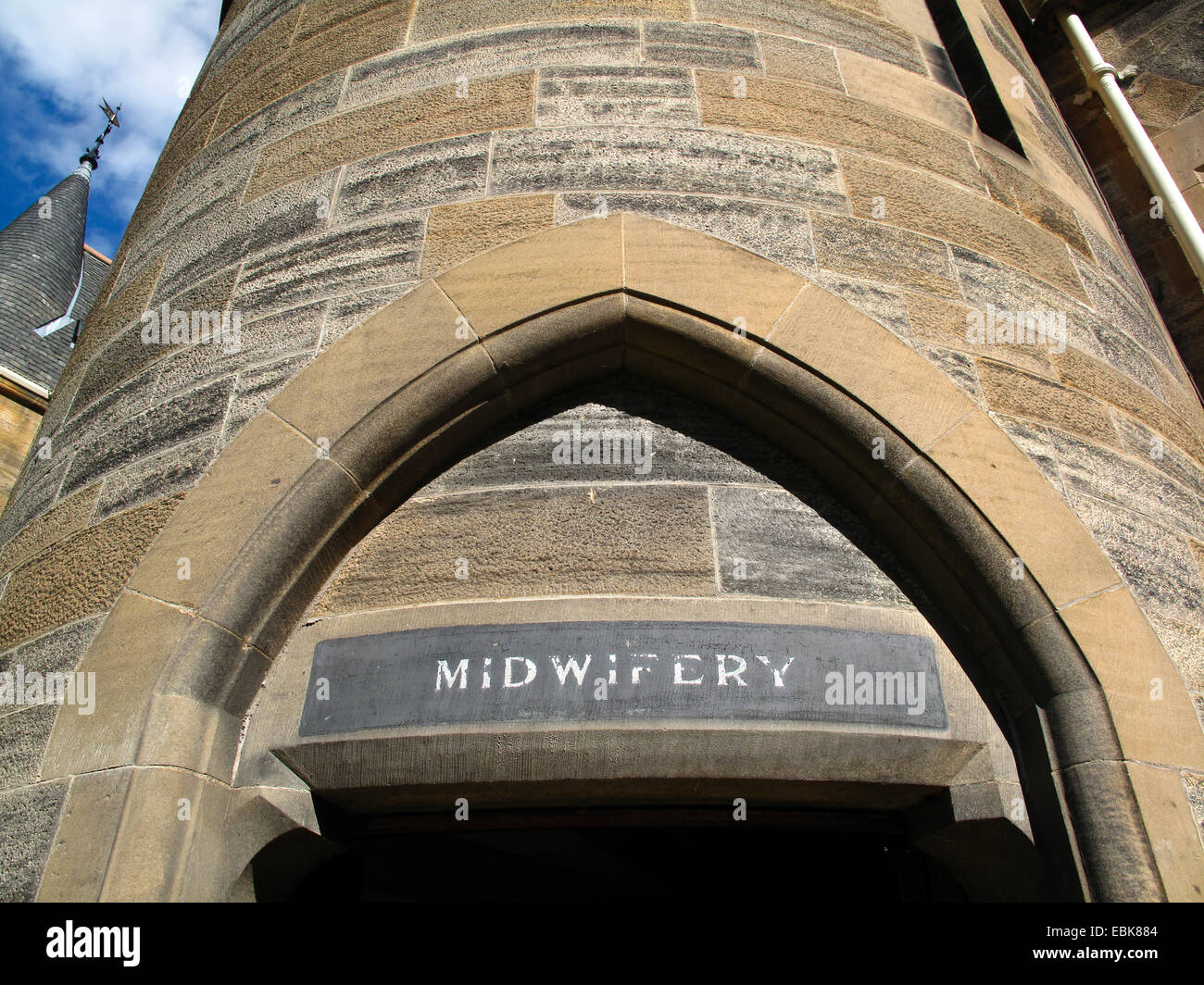 Old Midwifery sign on Glasgow University stair tower Stock Photo - Alamy