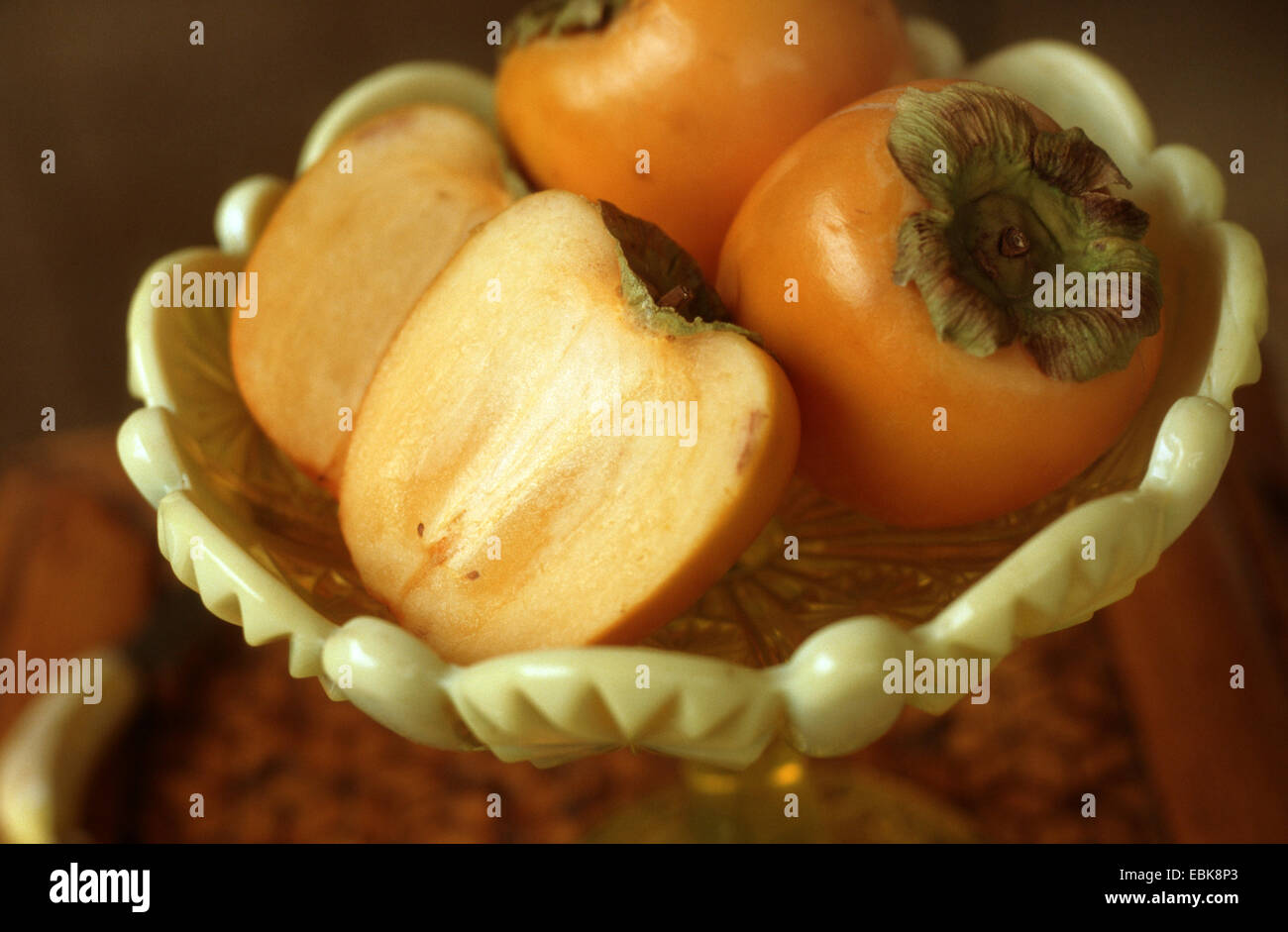 Kakis fruits in kaki tree hi-res stock photography and images - Alamy
