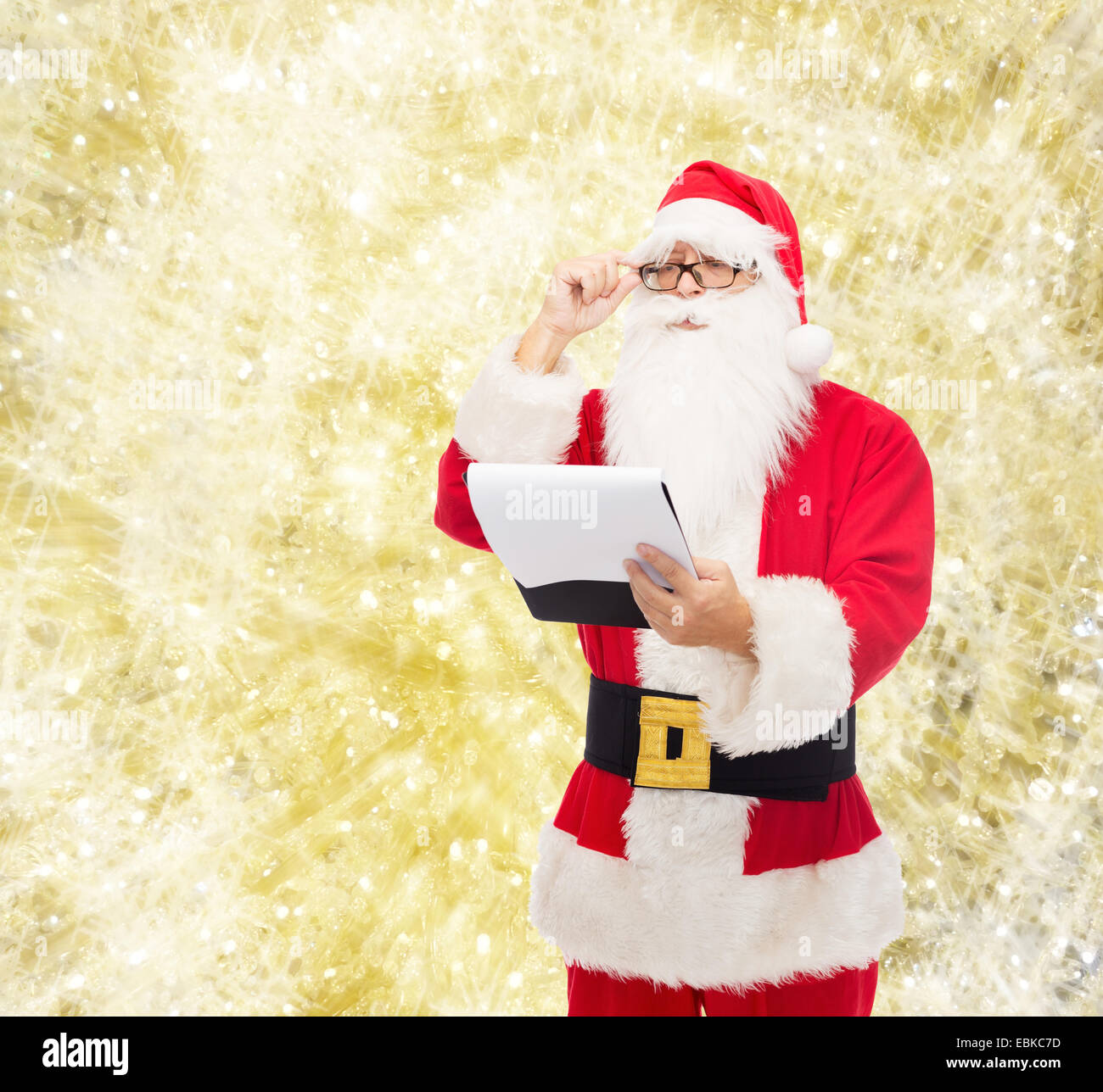 man in costume of santa claus with notepad Stock Photo - Alamy