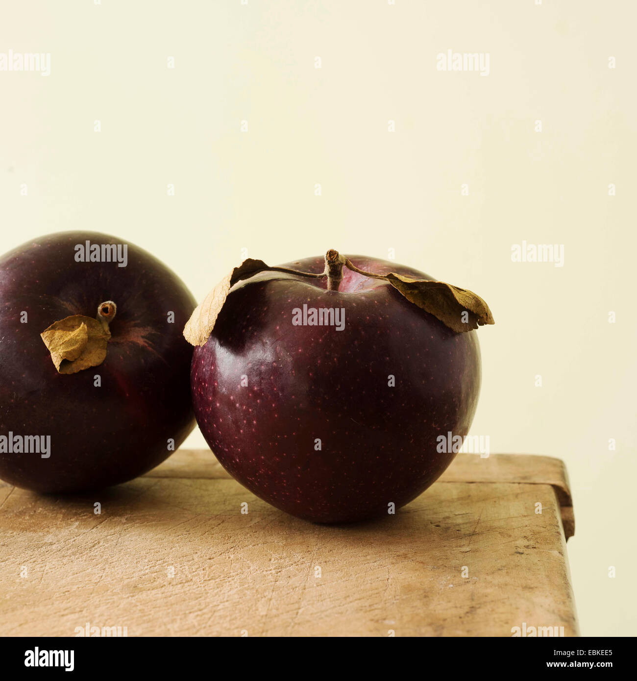 Studio shot of purple apples Stock Photo - Alamy