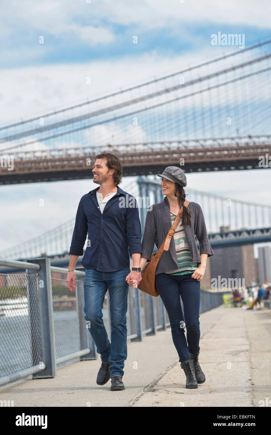 USA, New York State, New York City, Brooklyn, Couple walking on ...