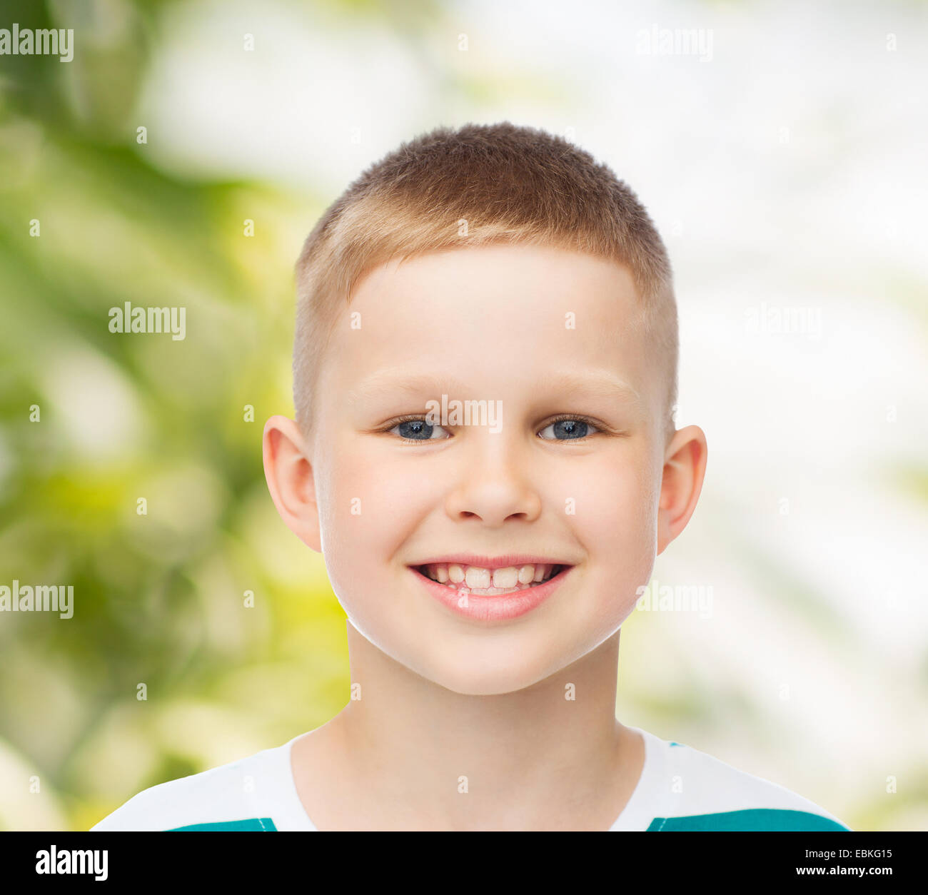 smiling little boy over green background Stock Photo - Alamy