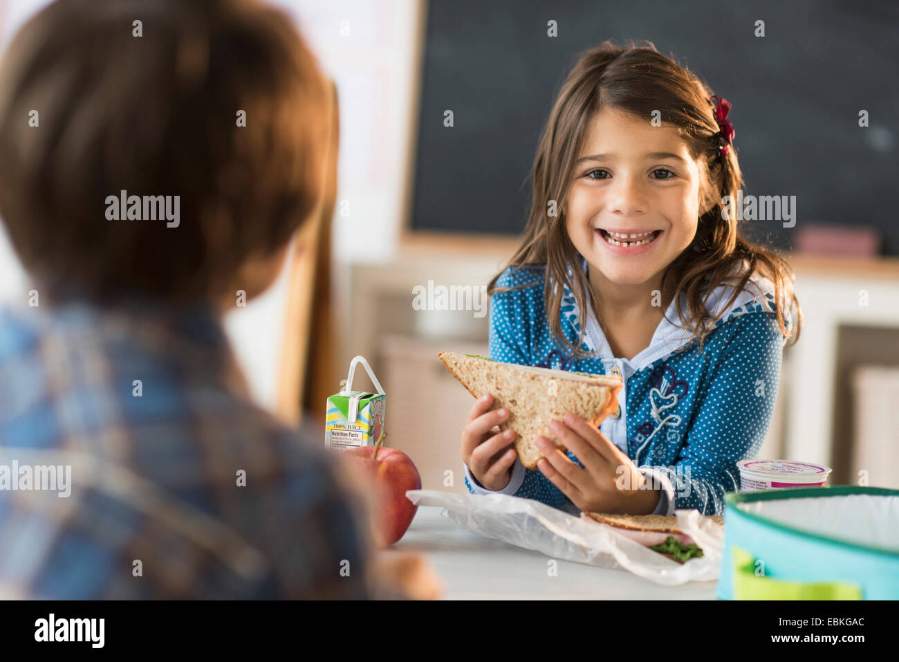 Pupils (6-7) eating lunch in classroom Stock Photo - Alamy
