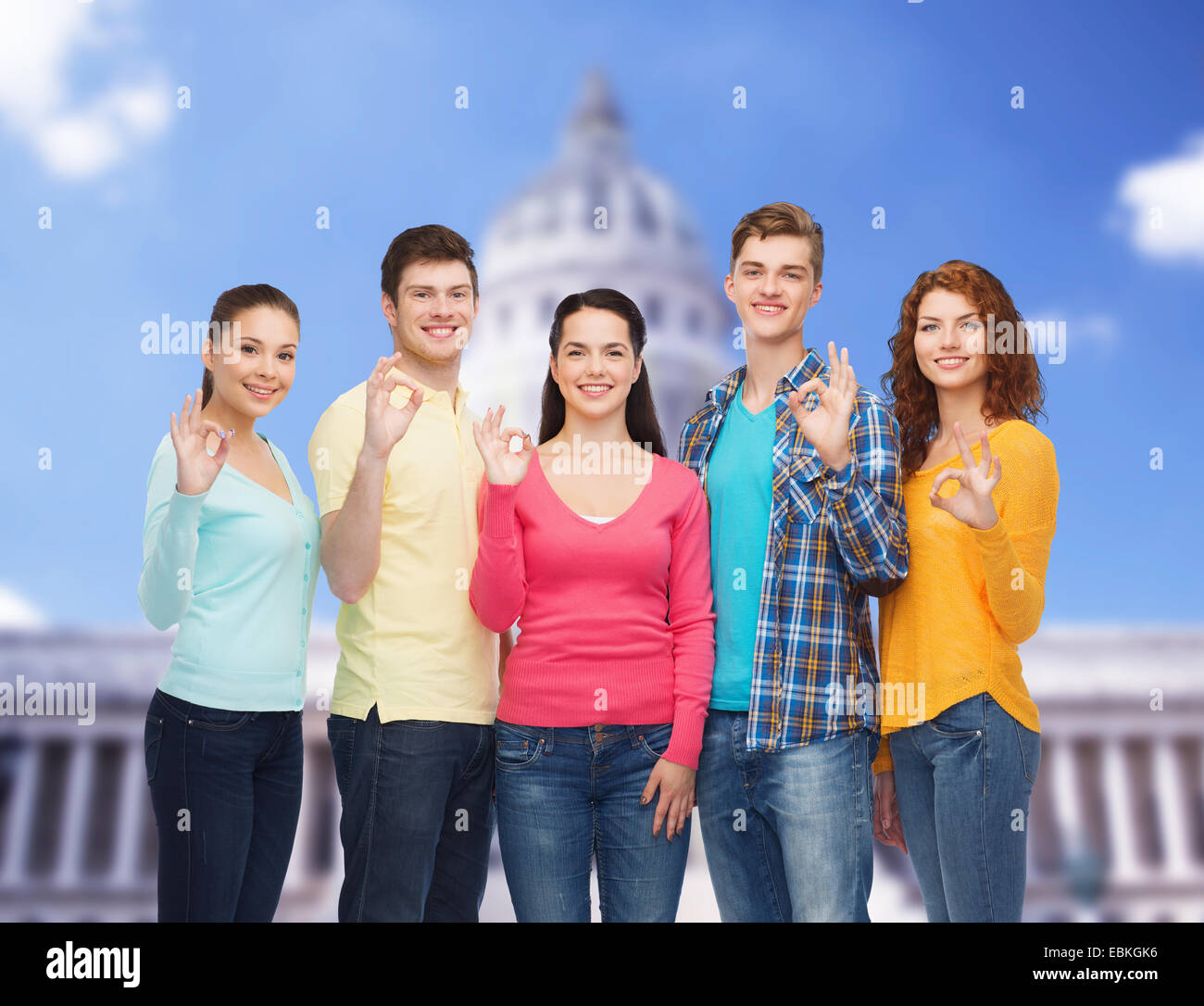 group of smiling teenagers showing ok sign Stock Photo - Alamy