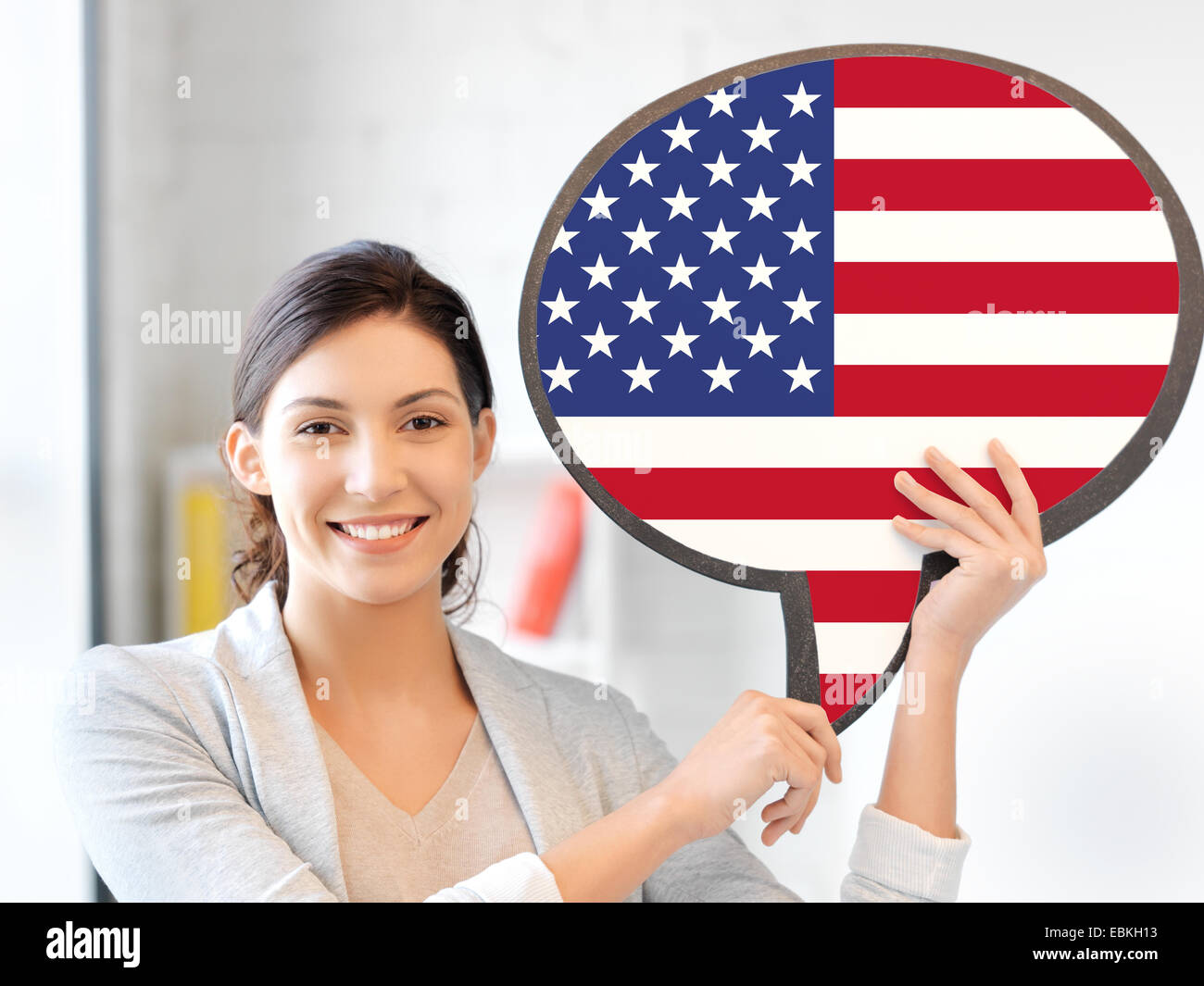 smiling woman with text bubble of american flag Stock Photo - Alamy