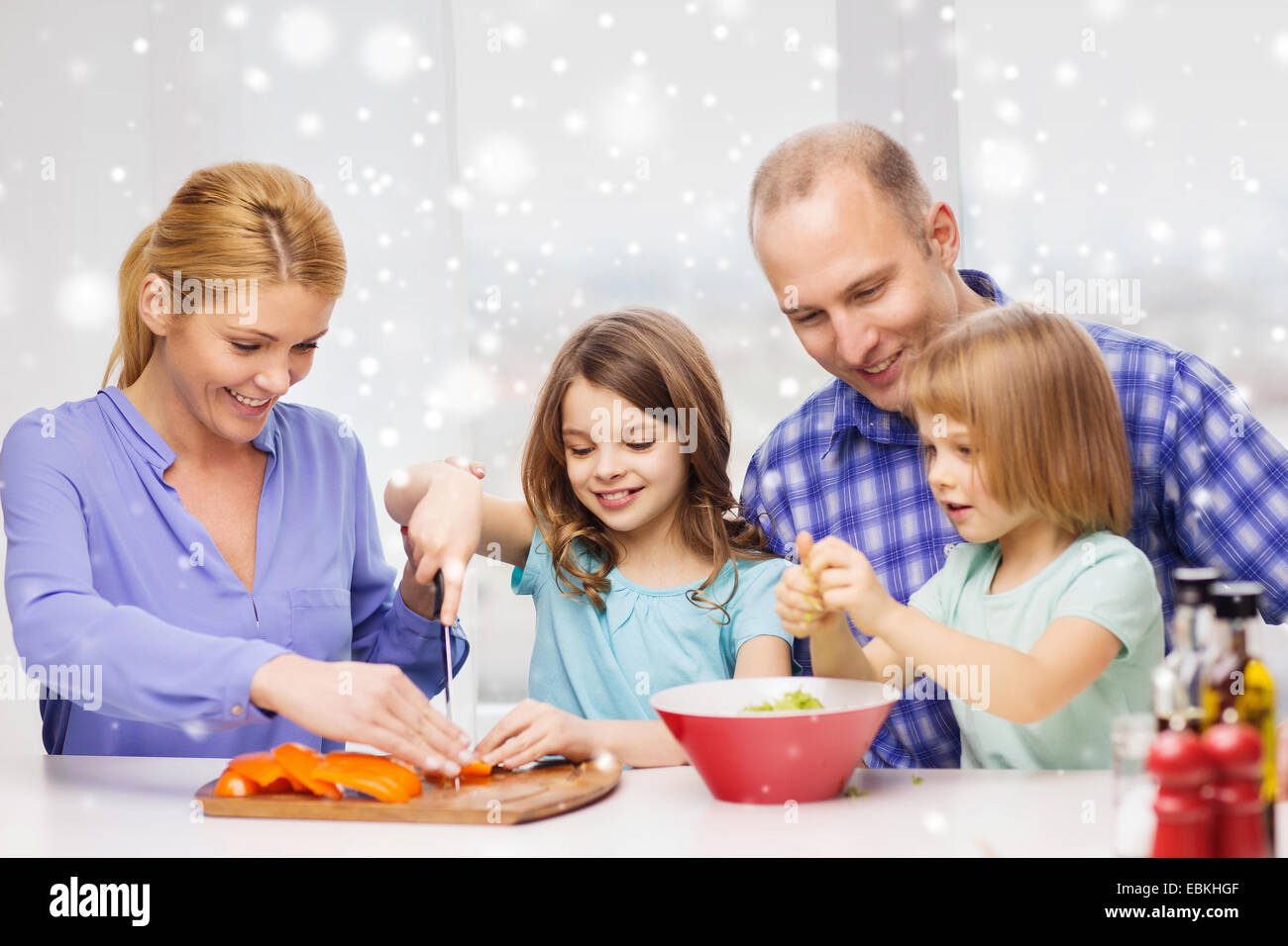 happy family with two kids making dinner at home Stock Photo - Alamy