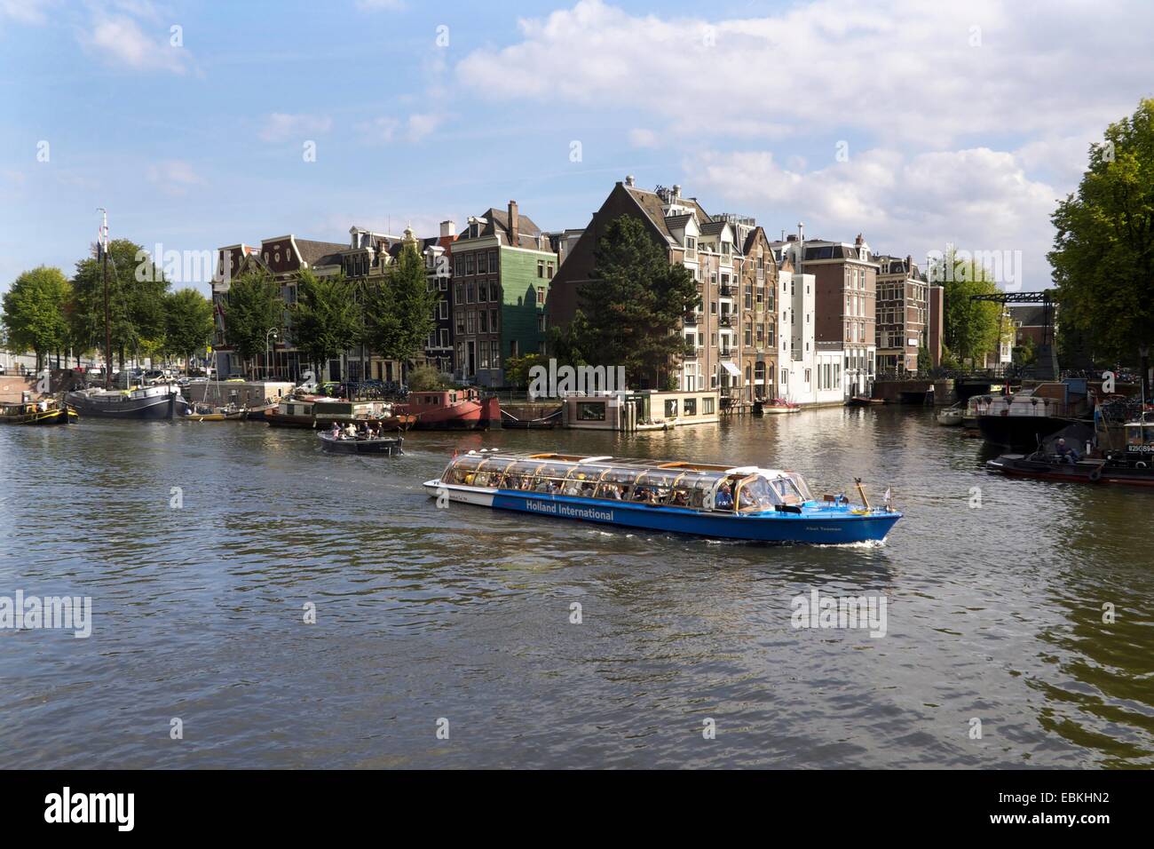 Exploring the charming canals of Amsterdam with a boat ride on a ...
