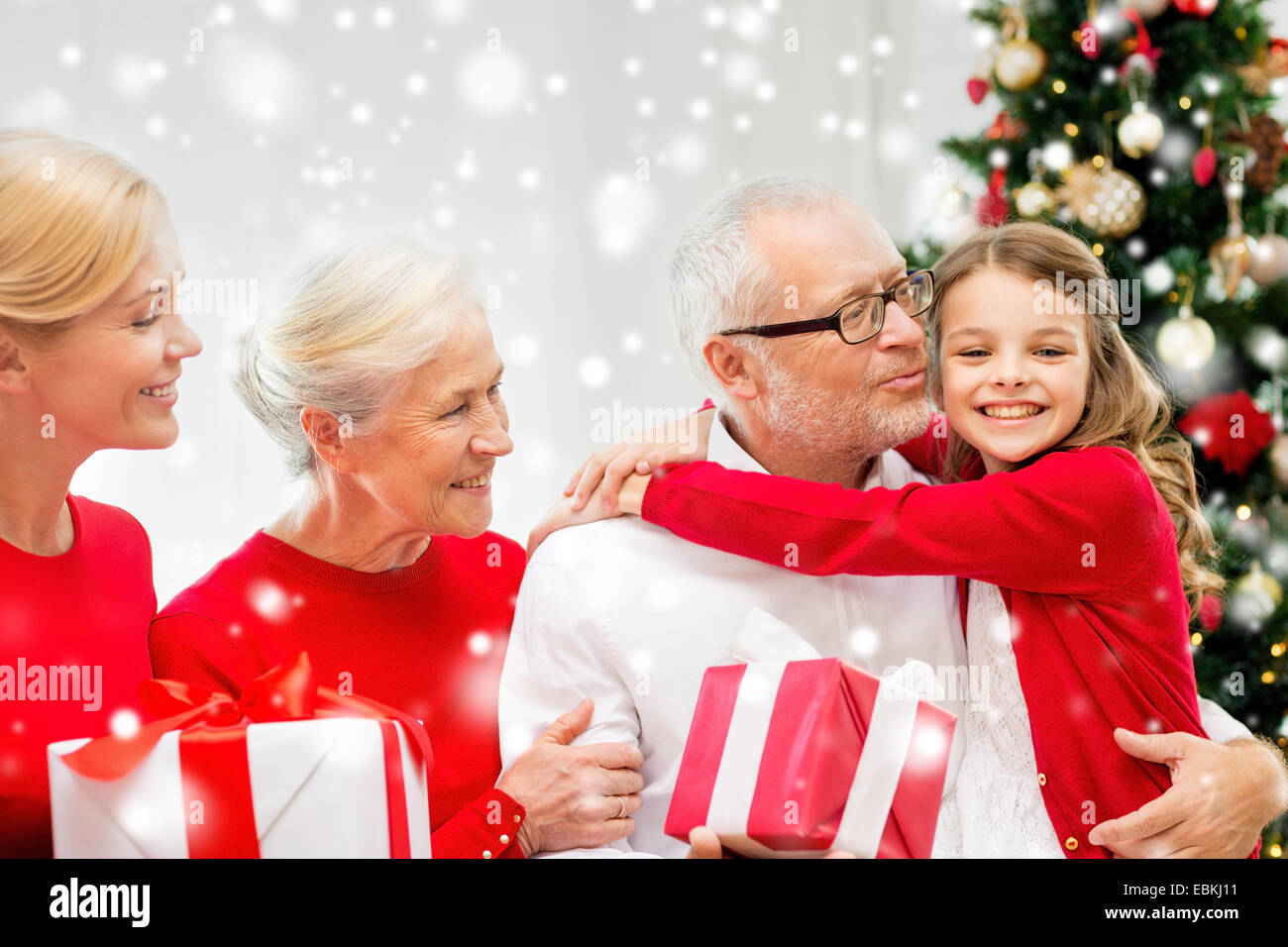 smiling family with gifts at home Stock Photo - Alamy