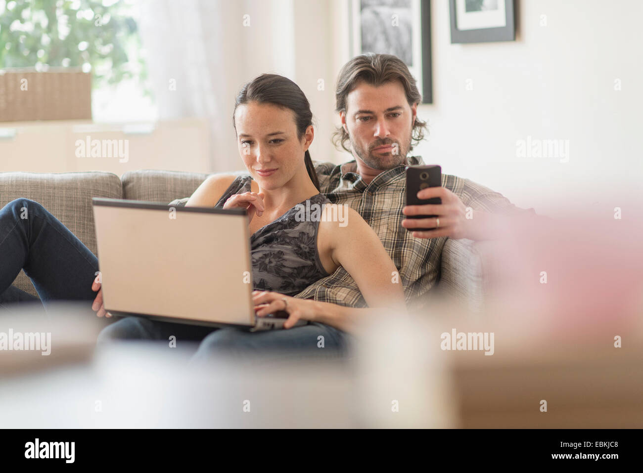 Woman looks phone watching hi-res stock photography and images - Alamy