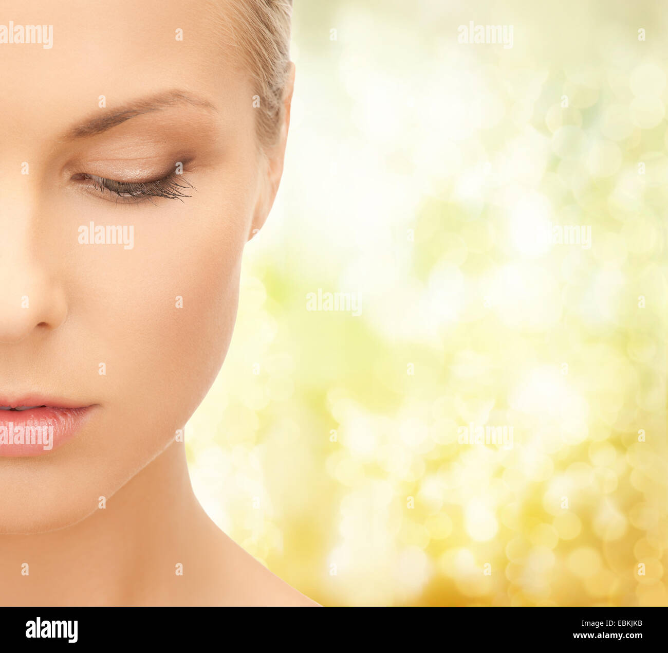 beautiful young woman over yellow background Stock Photo - Alamy