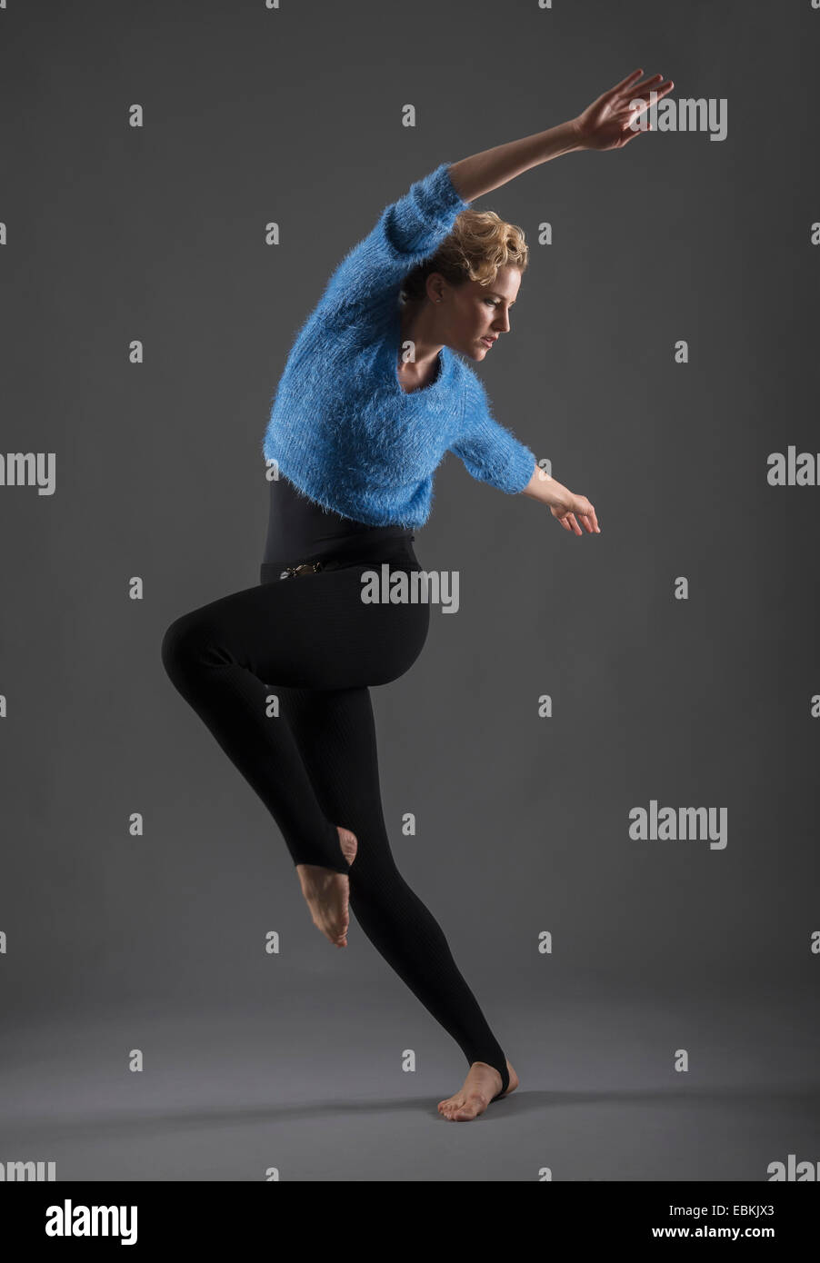 Female ballet dancer on one leg with arms outstretched hi-res stock ...