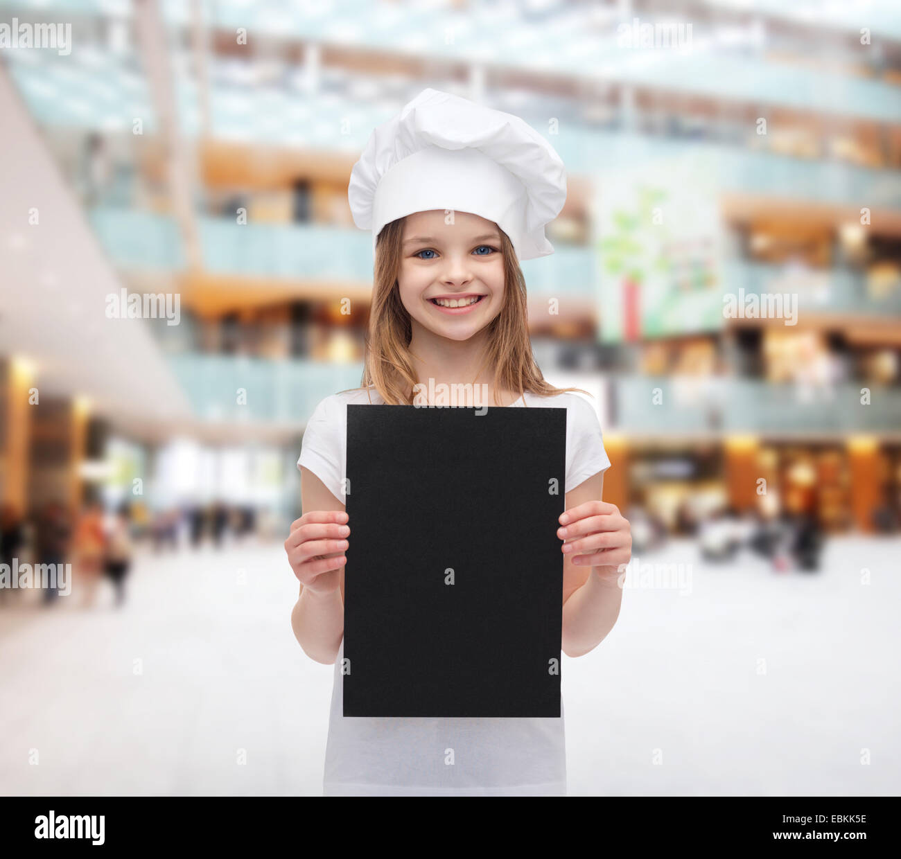 little cook or baker with blank black paper Stock Photo - Alamy