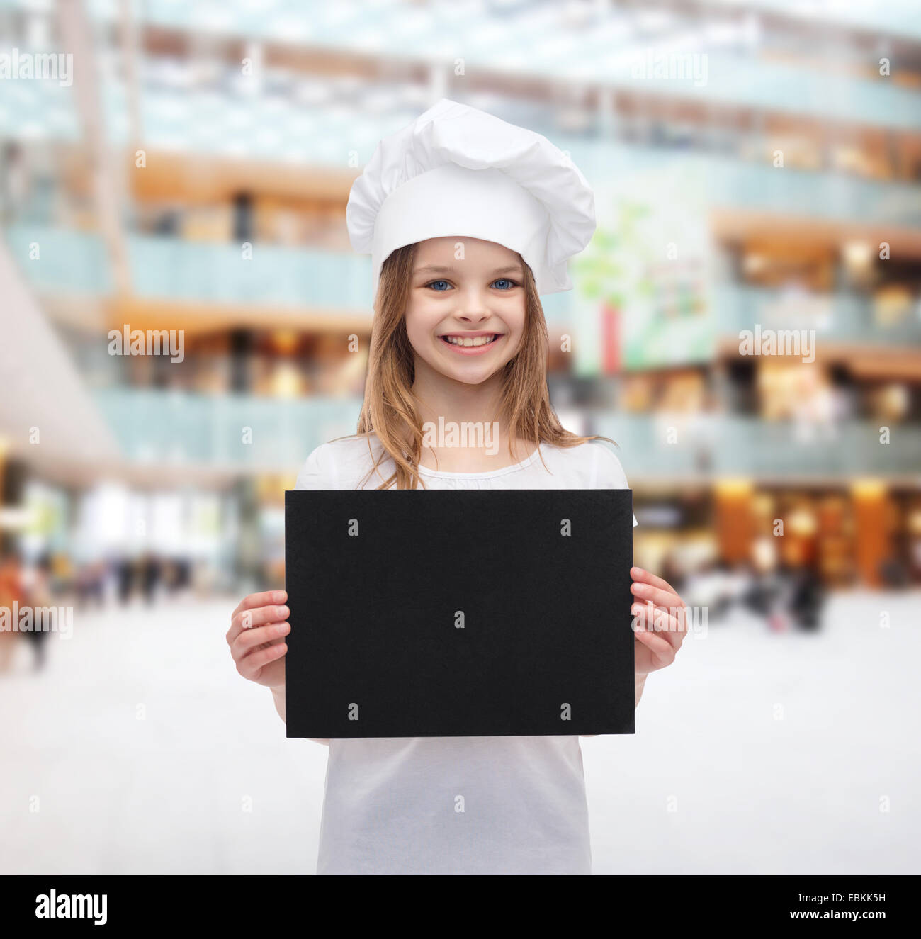 little cook or baker with blank black paper Stock Photo - Alamy