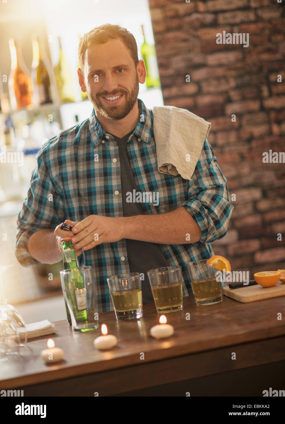 Portrait of smiling bartender Stock Photo - Alamy