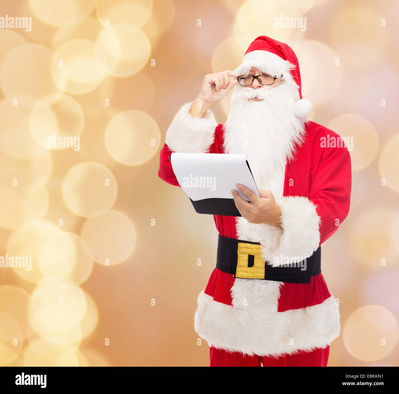 man in costume of santa claus with notepad Stock Photo - Alamy