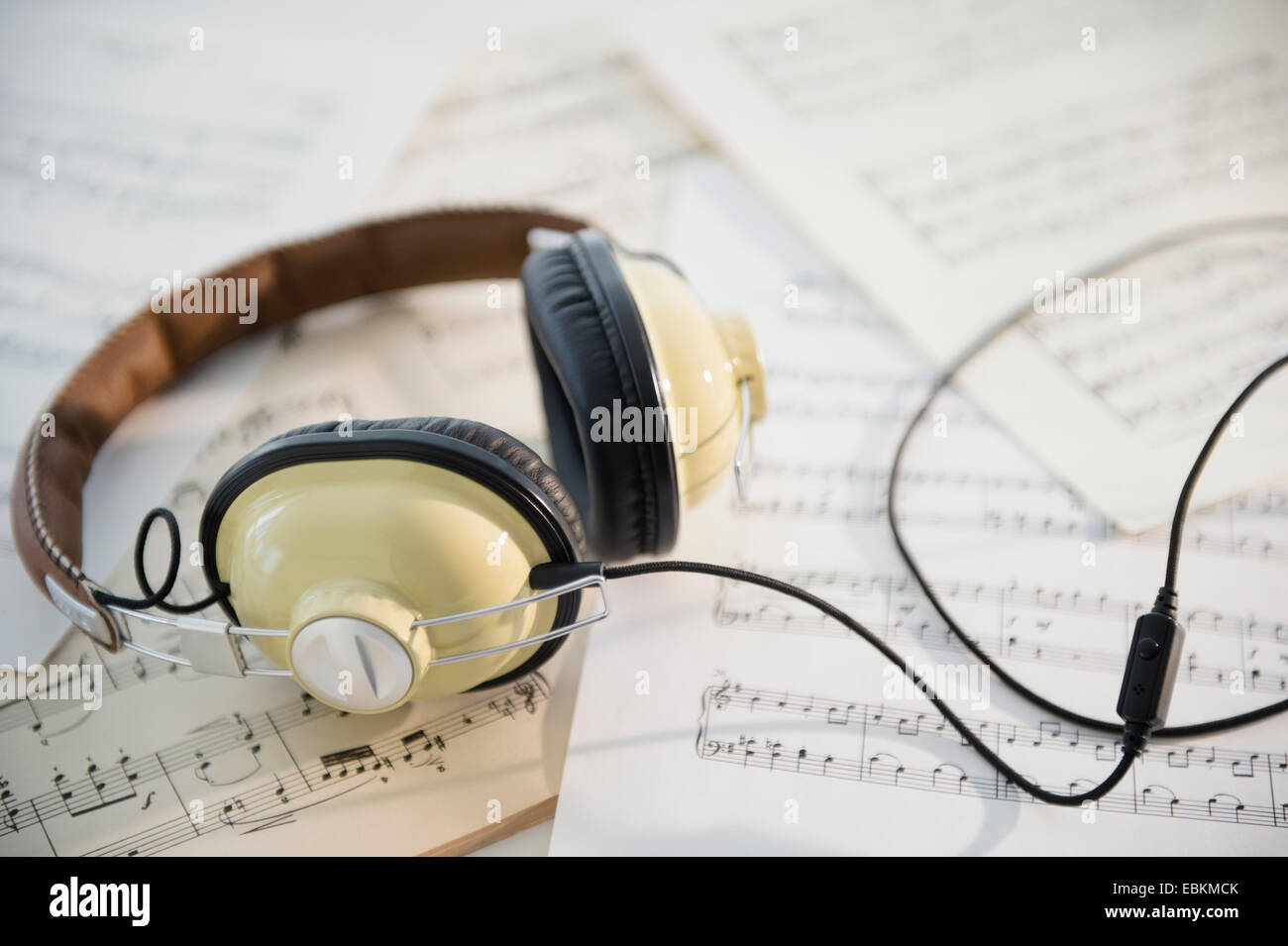 Headphones and music sheets Stock Photo - Alamy